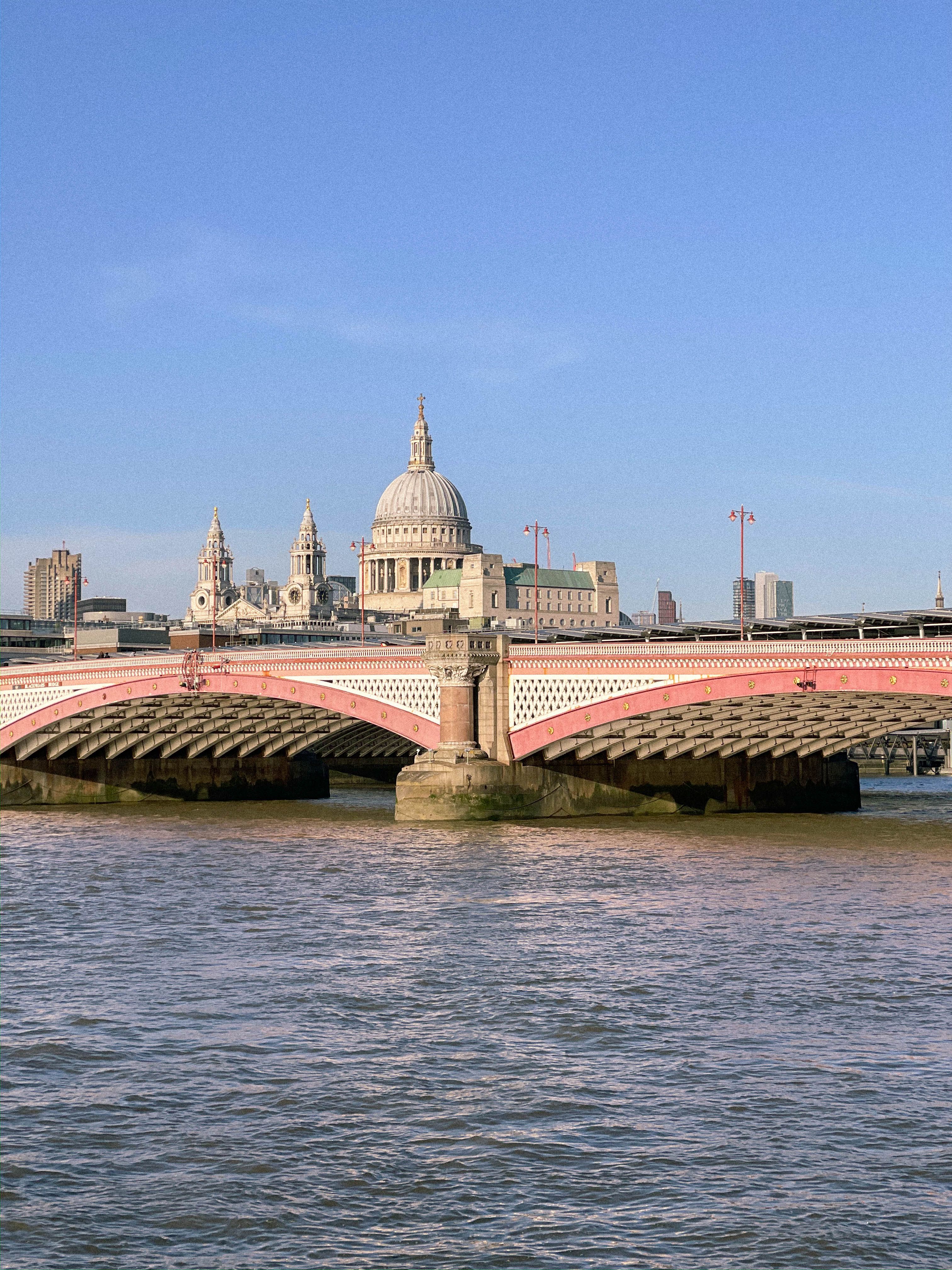 Aged cathedral and bridge in old European city · Free Stock Photo