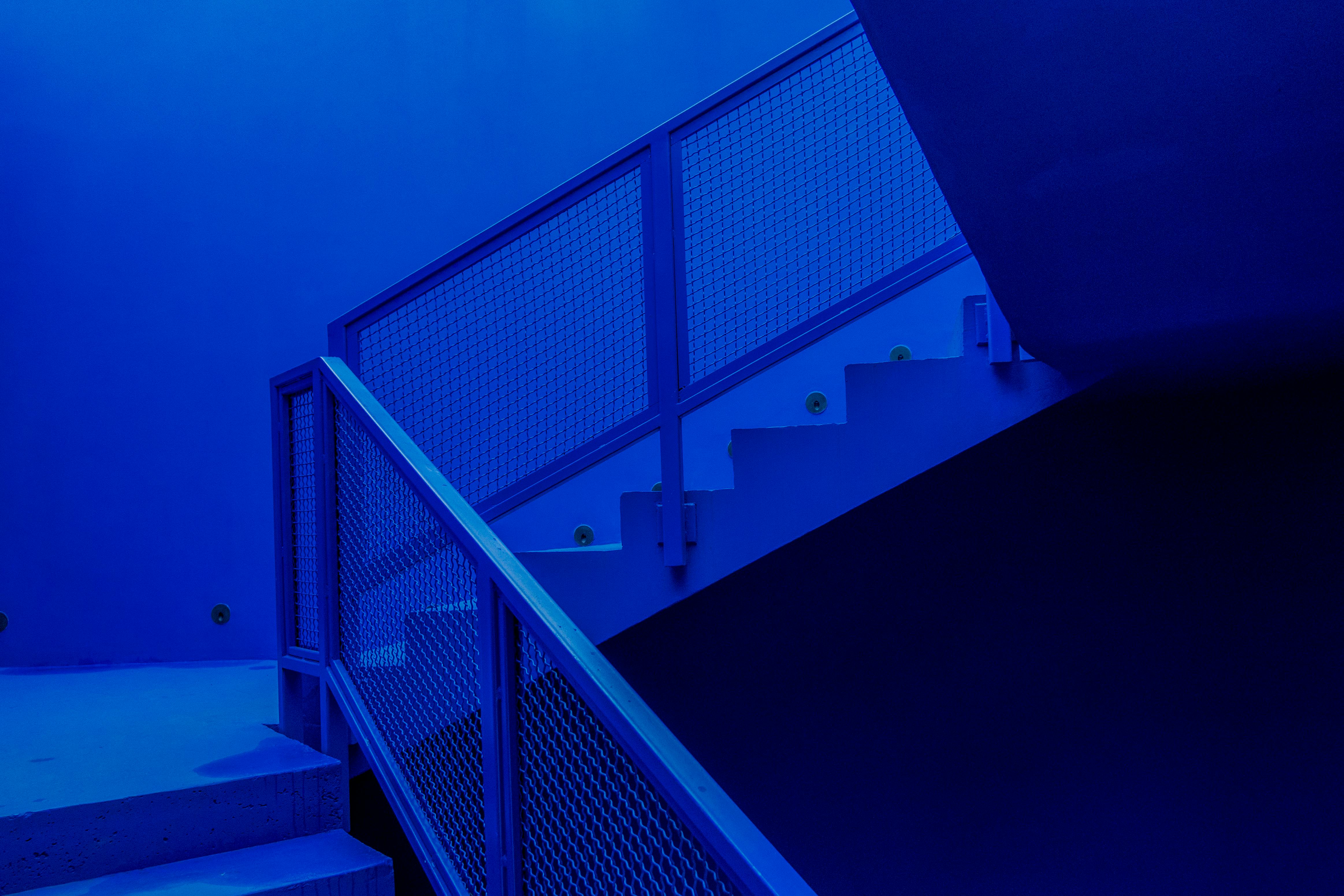 Staircase in modern building with blue neon light · Free Stock Photo