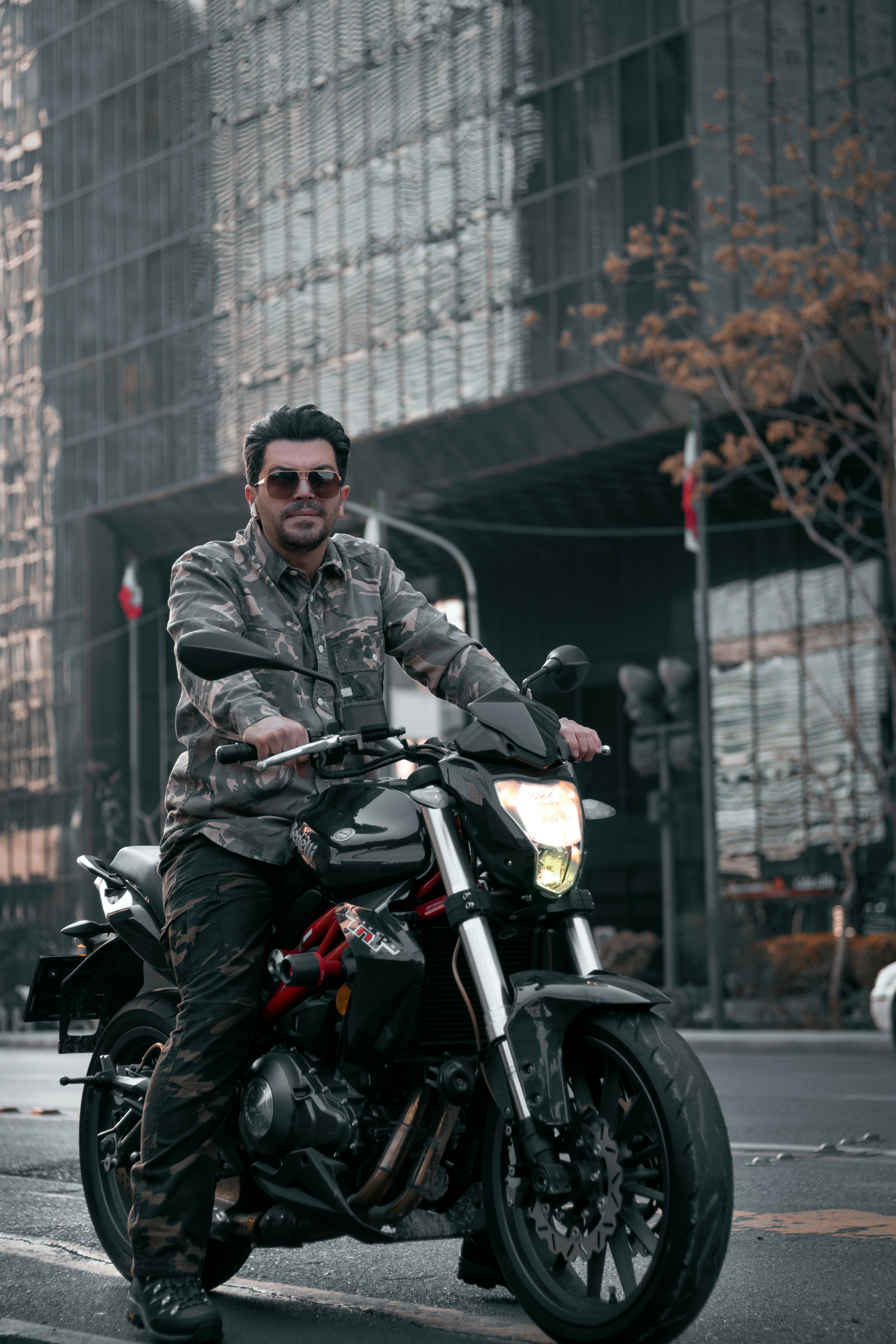 A Man Riding a Motorcycle · Free Stock Photo