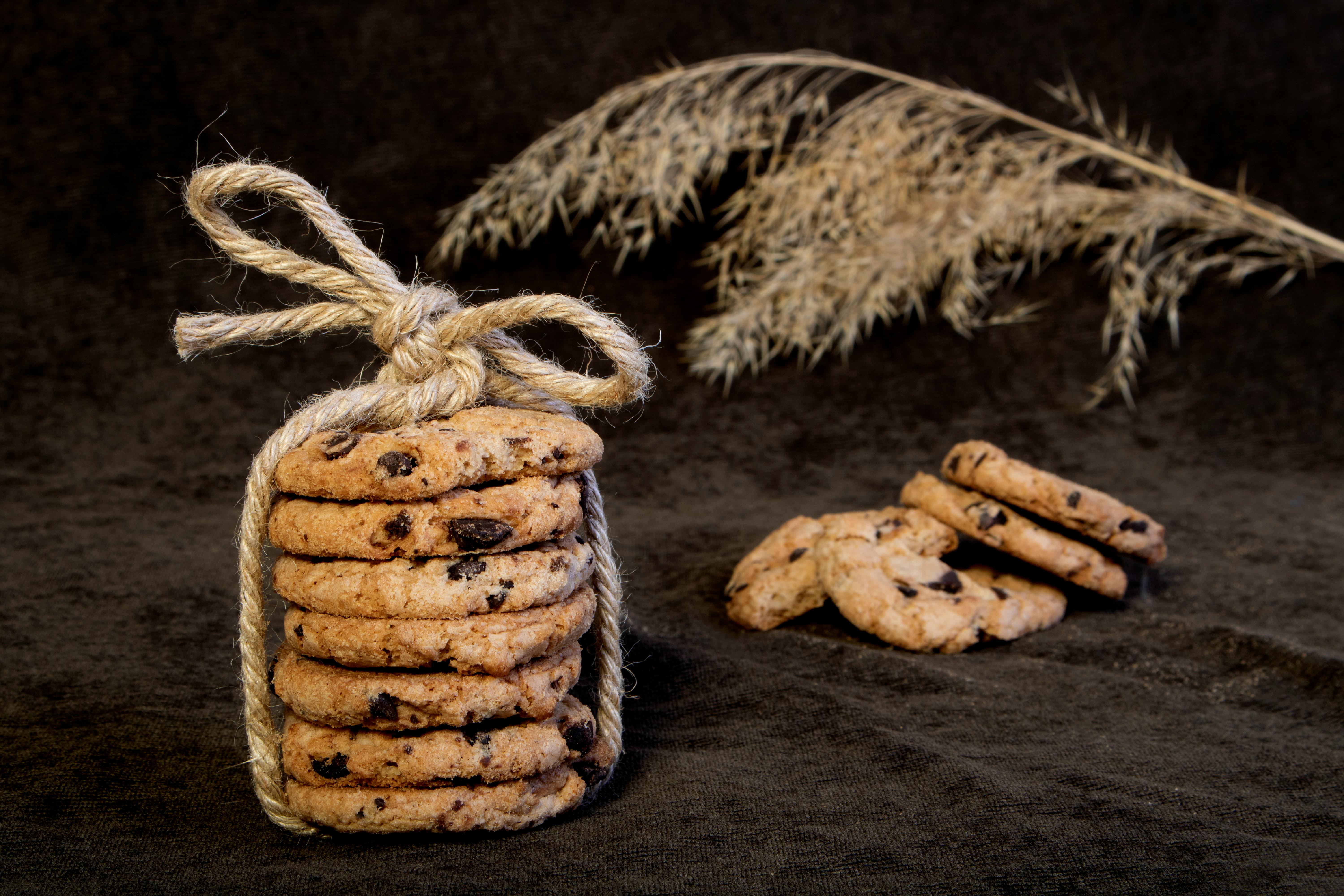 Stack of Brown Cookies Tied with Brown Rope · Free Stock Photo