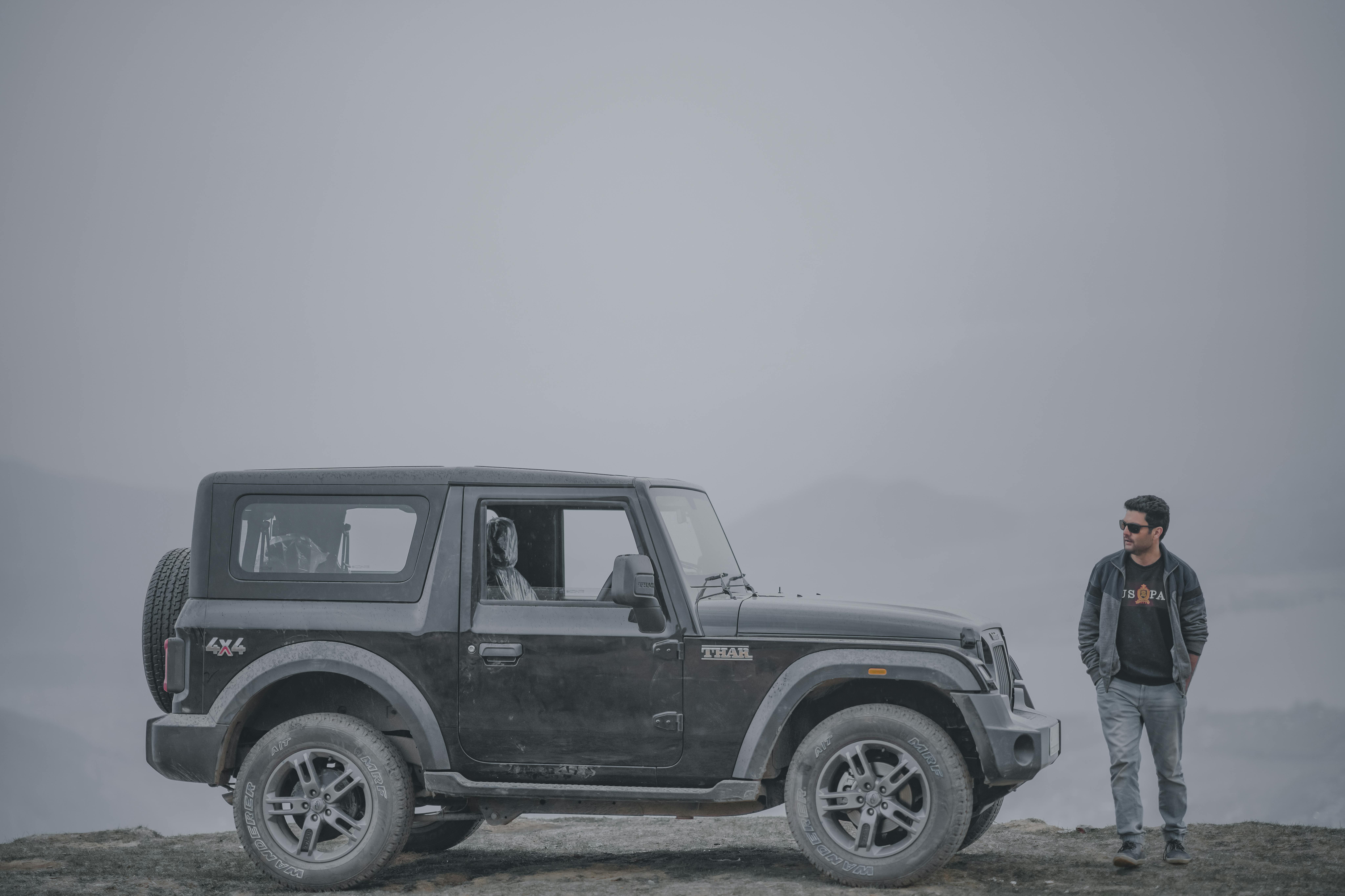 A Red Mahindra Thar on Dirt Road · Free Stock Photo
