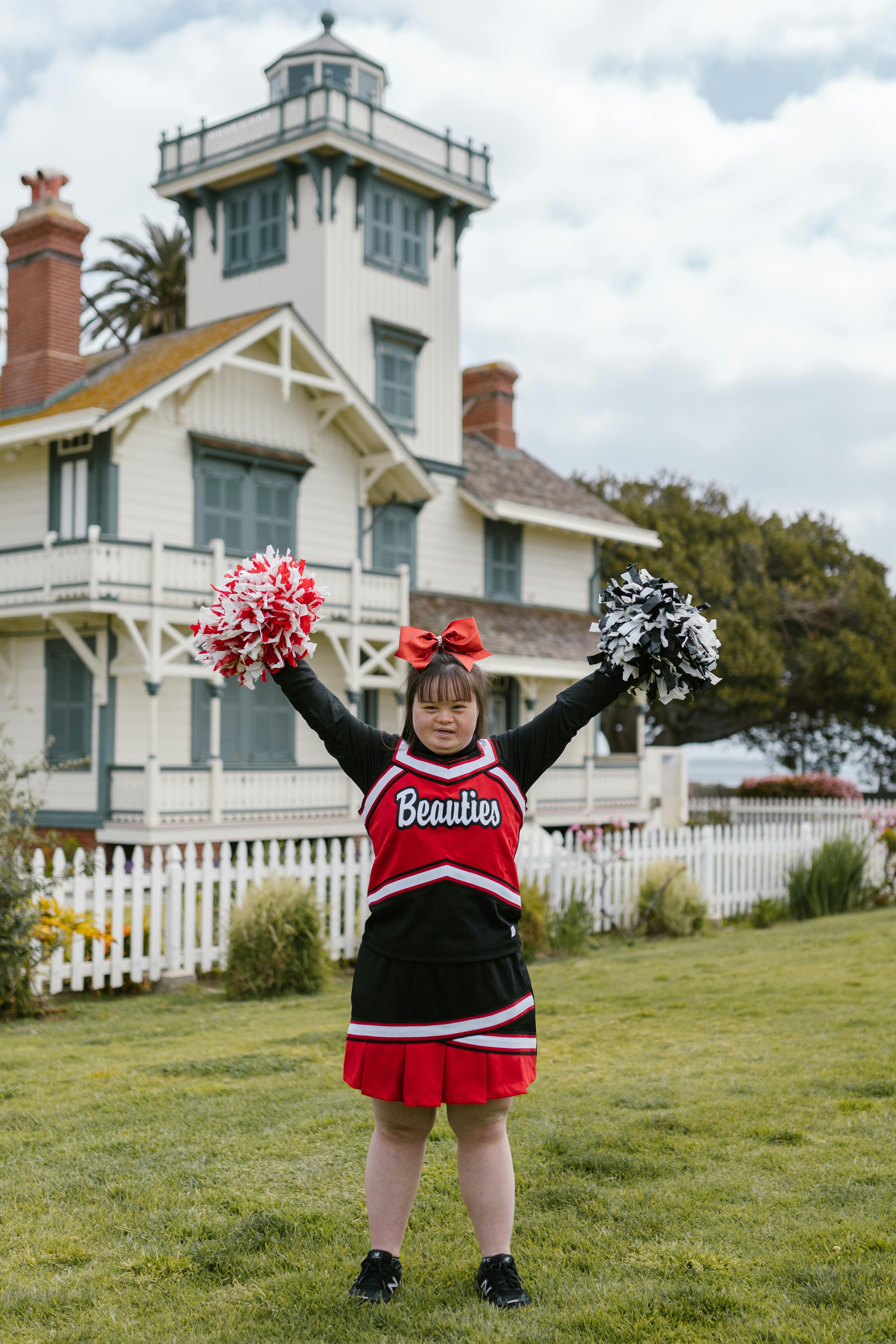A Woman in Cheerleader Outfit Standing Outside · Free Stock Photo
