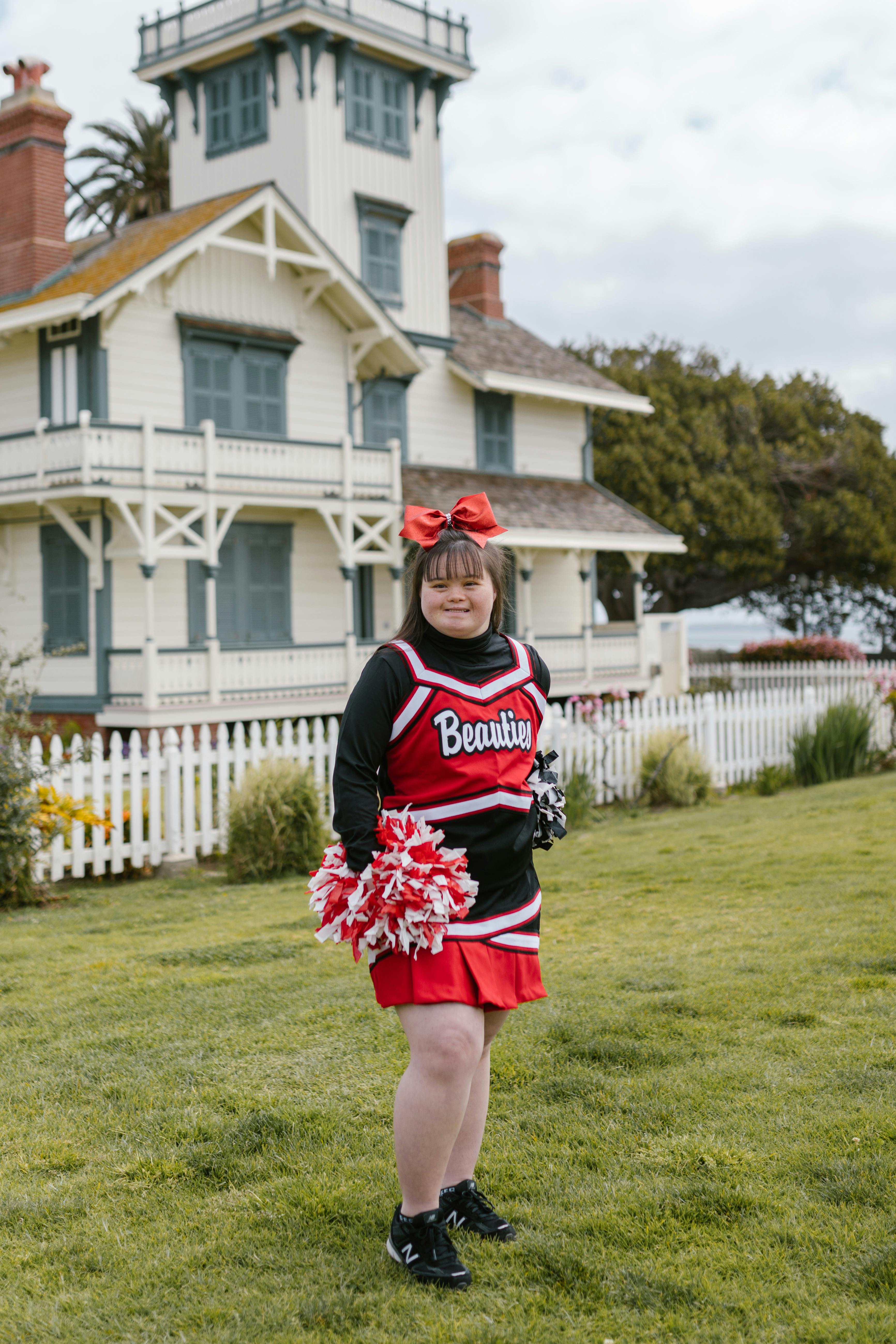 A Woman in Cheerleader Outfit Standing Outside · Free Stock Photo