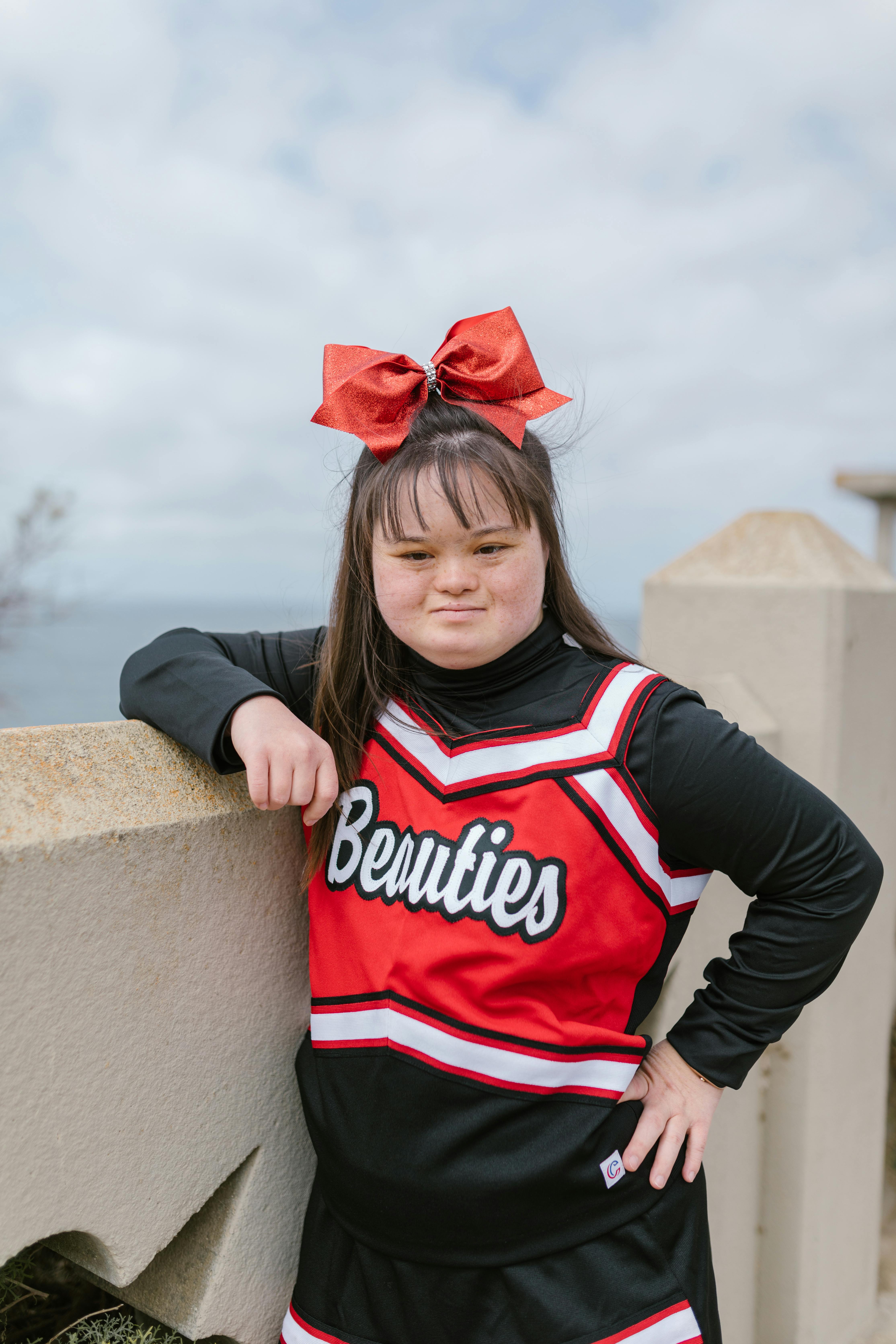 A Woman in Cheerleader Outfit Showing Her Watch · Free Stock Photo