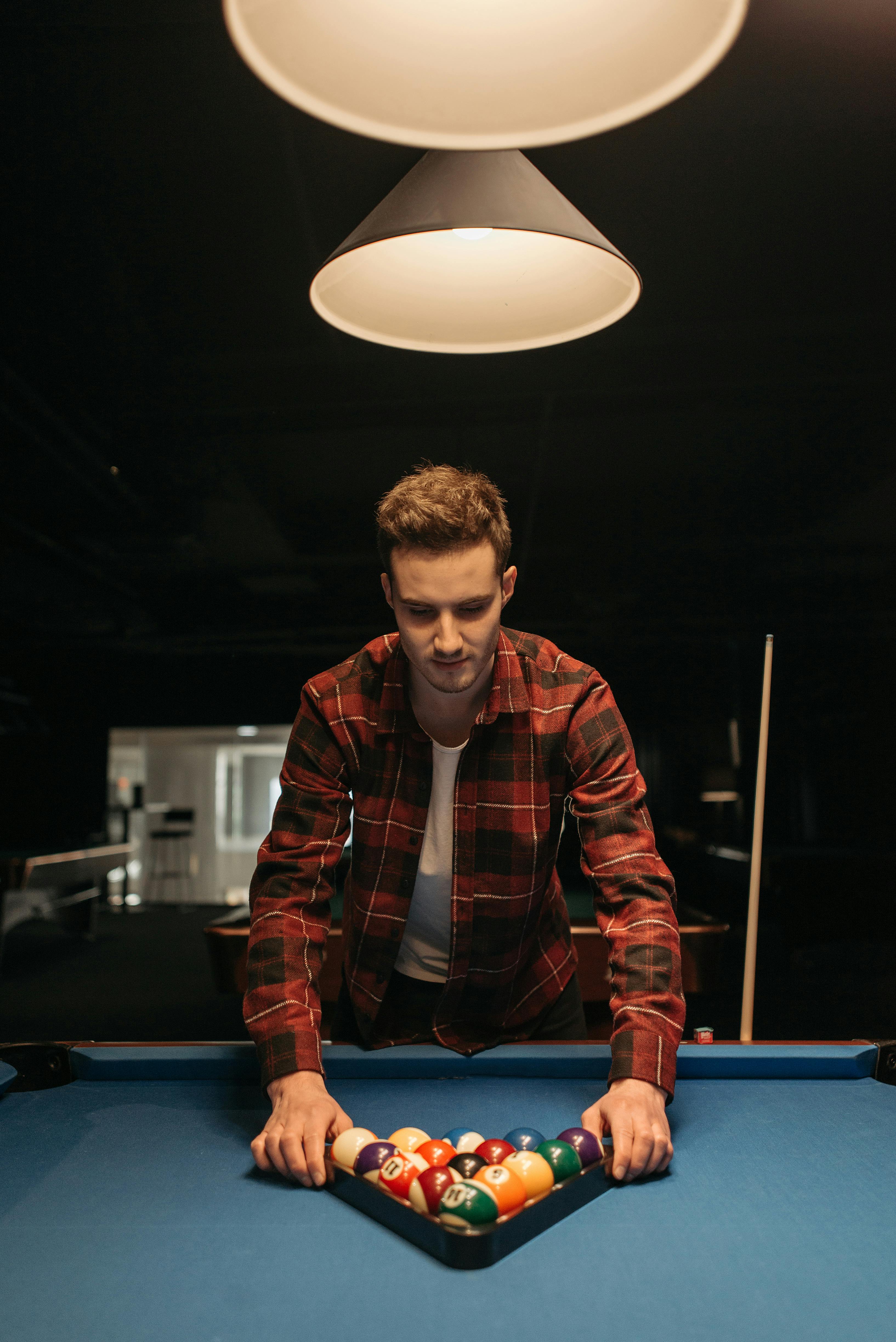 A Man Setting Up the Billiard Table · Free Stock Photo