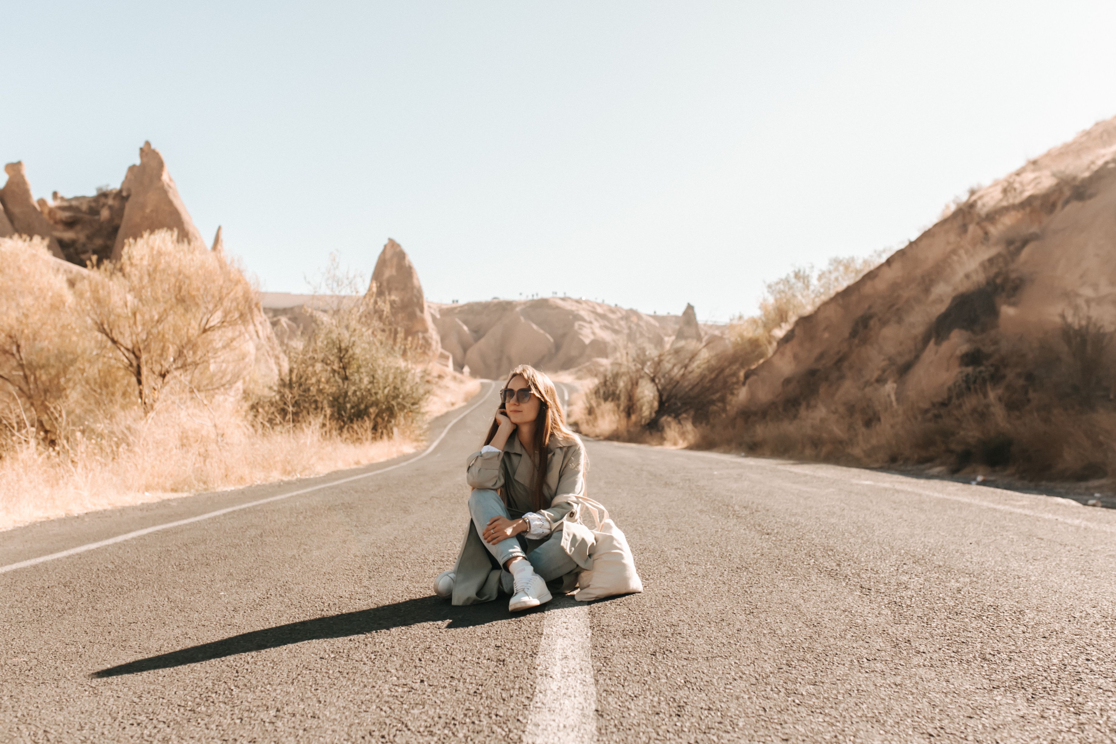 Woman Sitting on a Road · Free Stock Photo