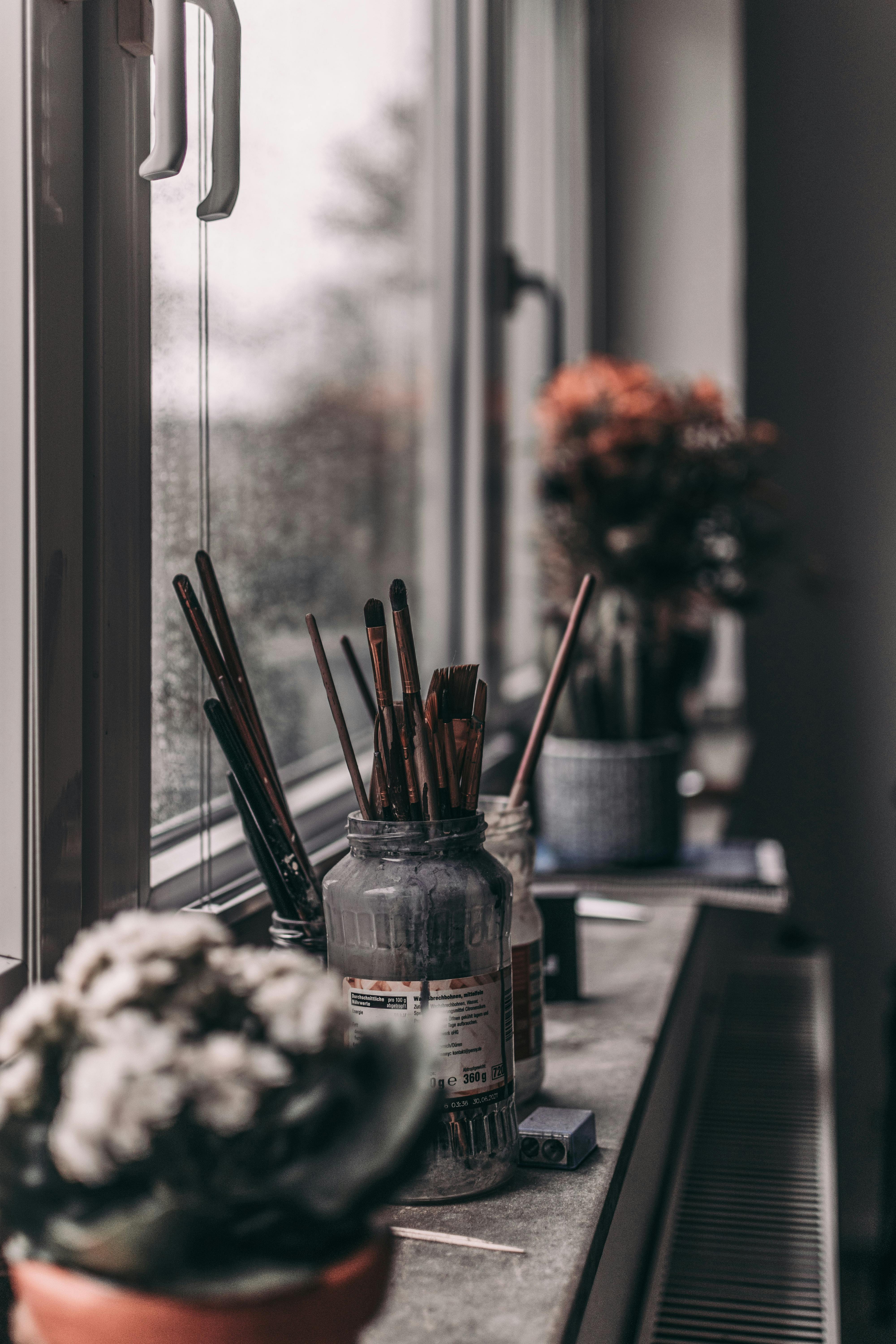 Paintbrushes and Holders on the Window Sill · Free Stock Photo
