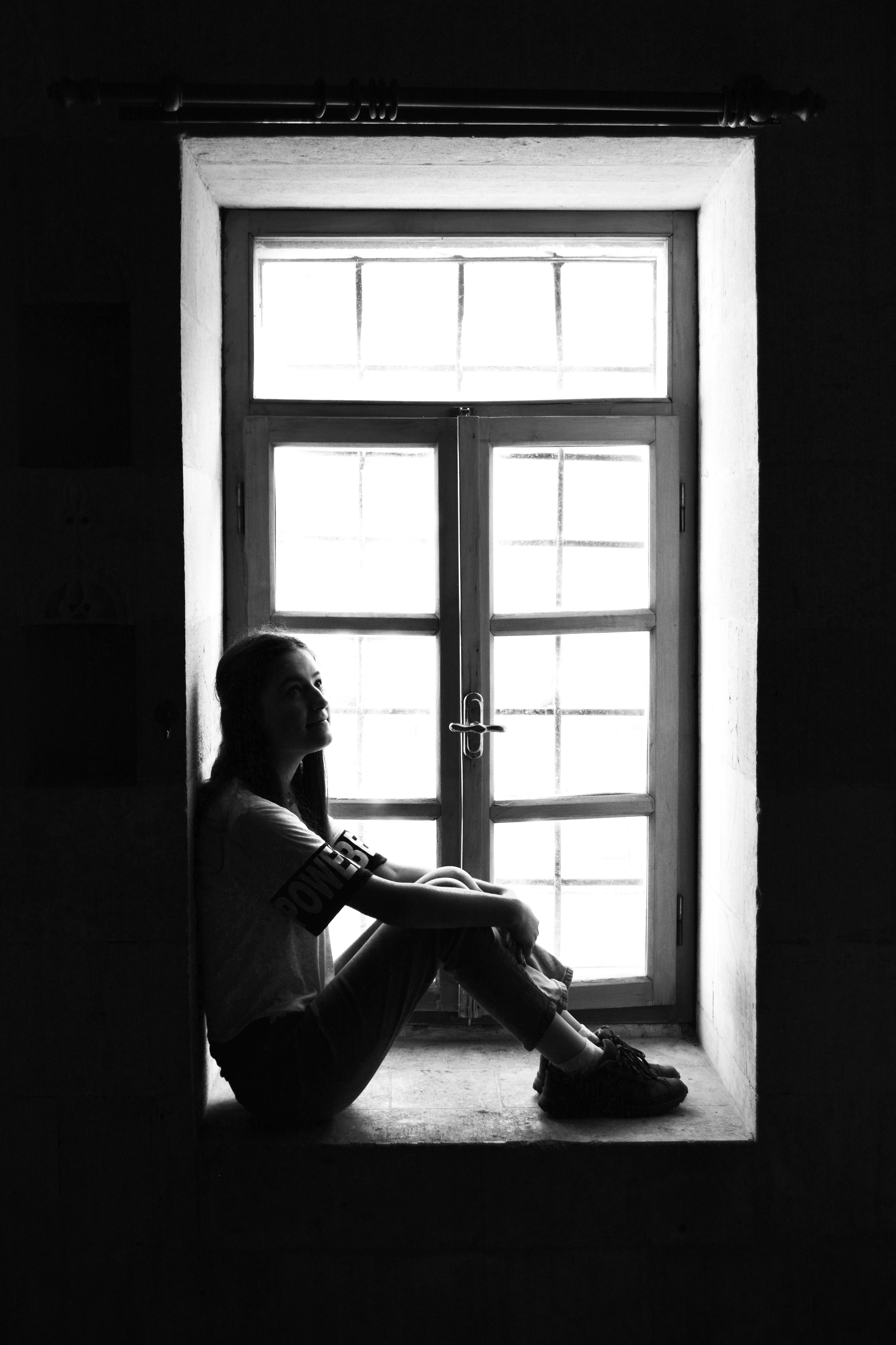 Woman Sitting Near the Window · Free Stock Photo