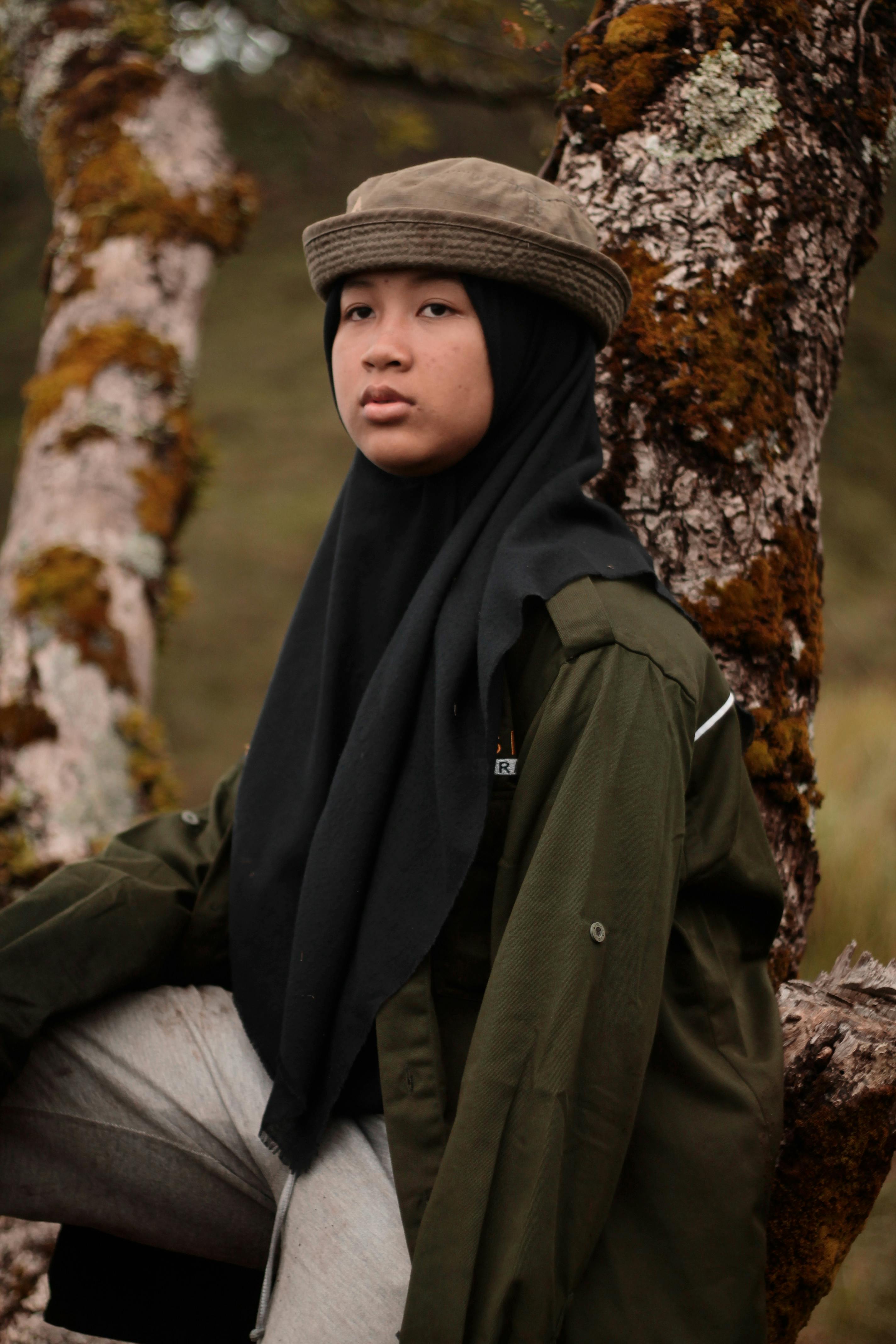 A Woman in a Hijab Wearing a Bucket Hat · Free Stock Photo