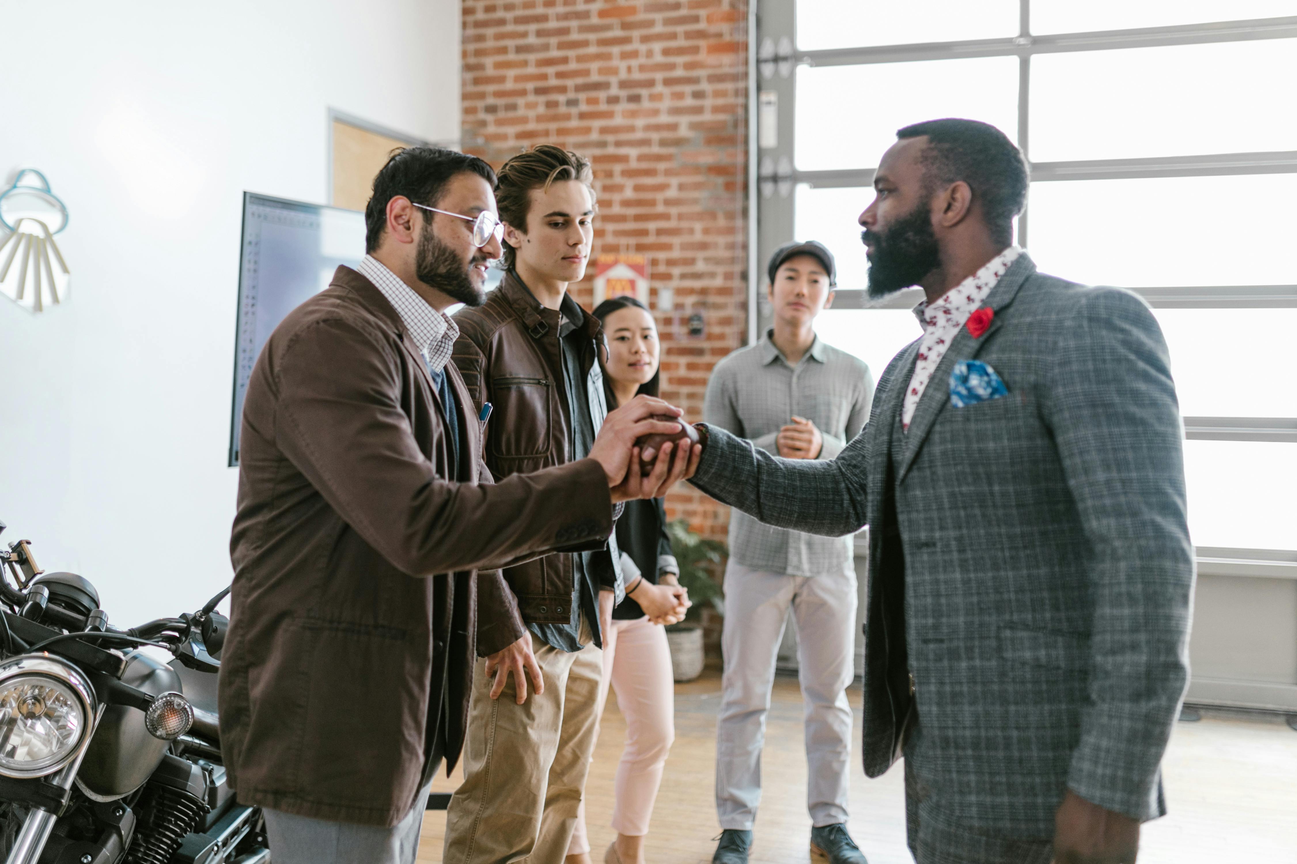 Group of People in a Conference Room Clapping · Free Stock Photo