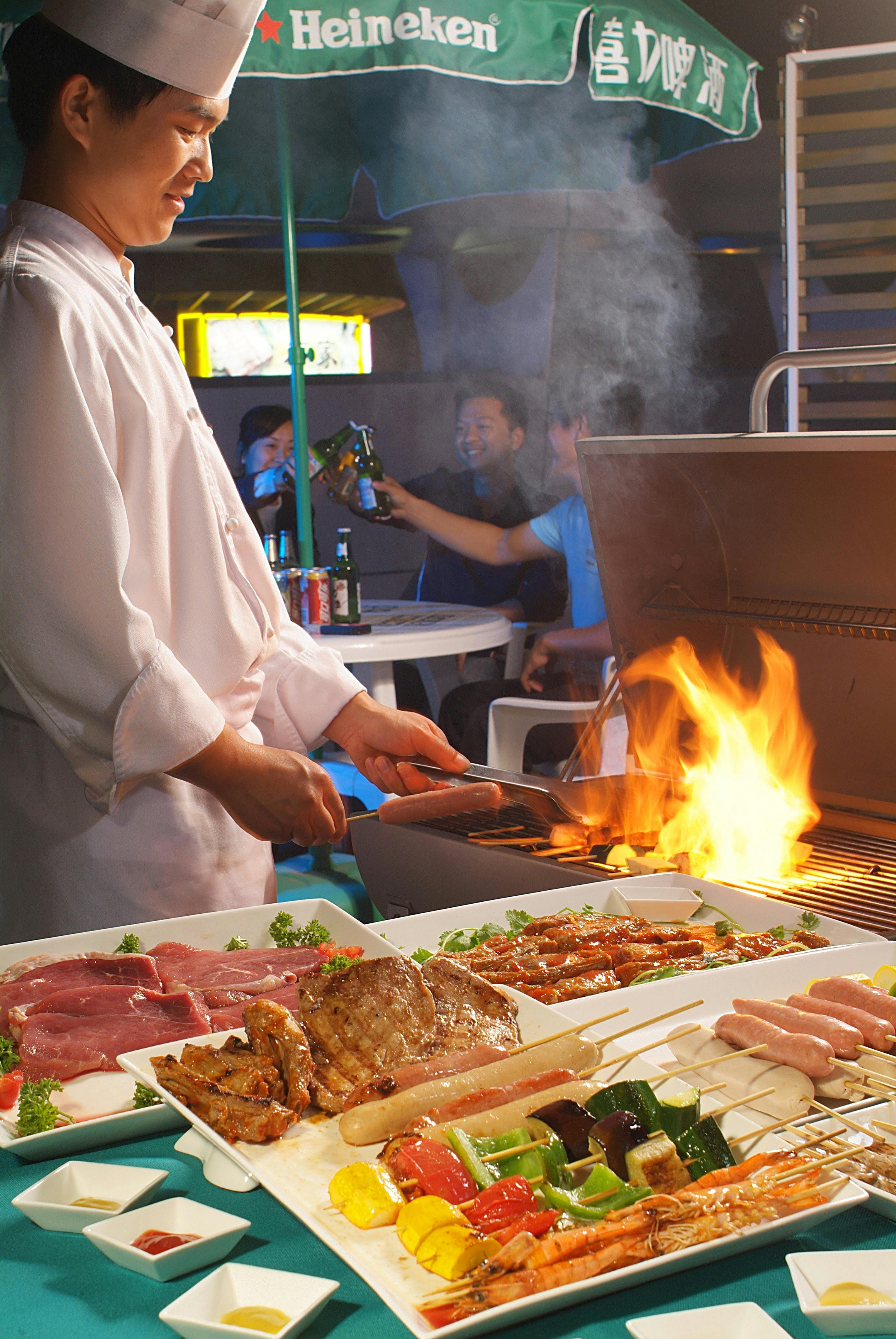 Photography of Man and Woman Grilling Food · Free Stock Photo
