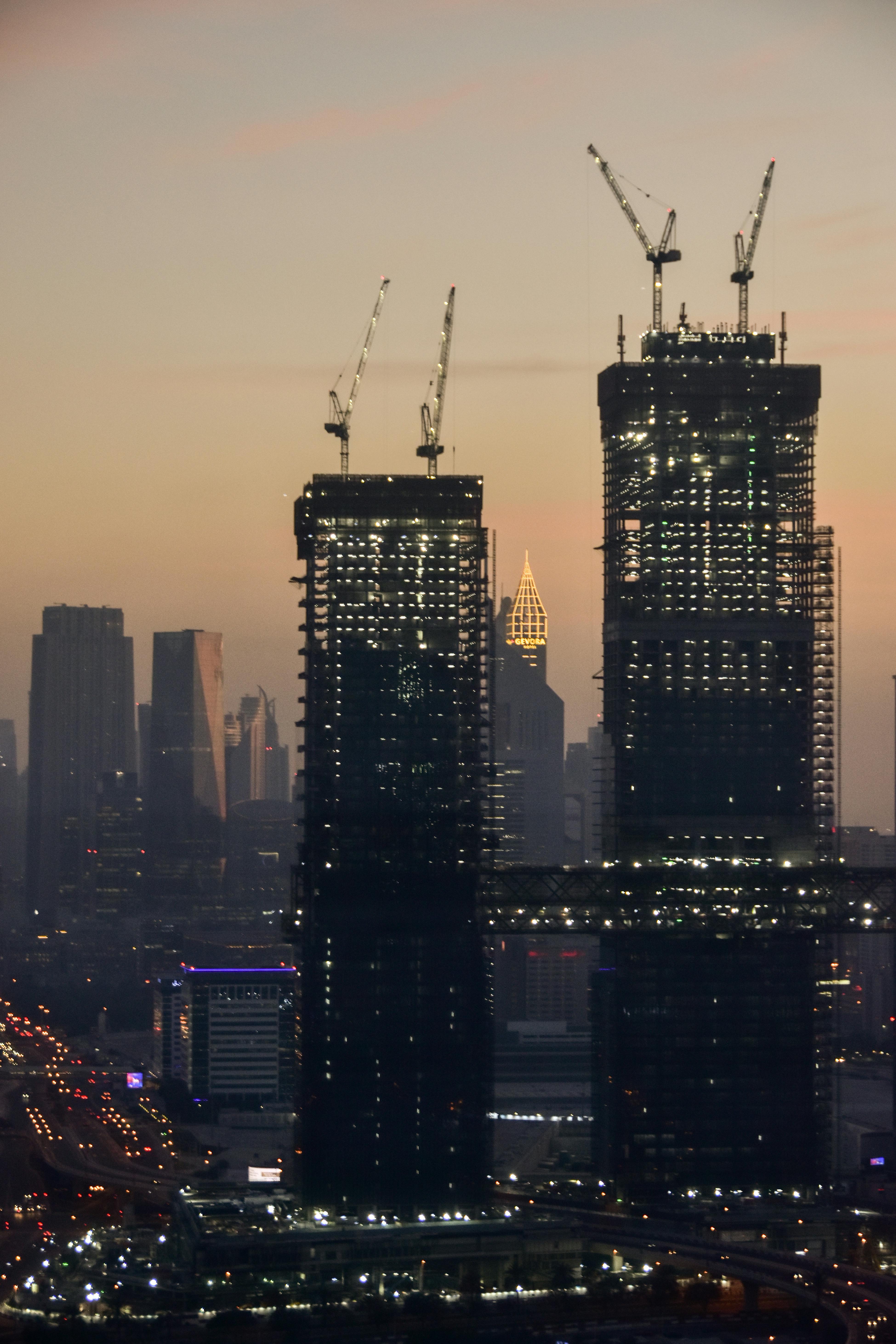 Silhouettes of High Rise Buildings During Sunset · Free Stock Photo