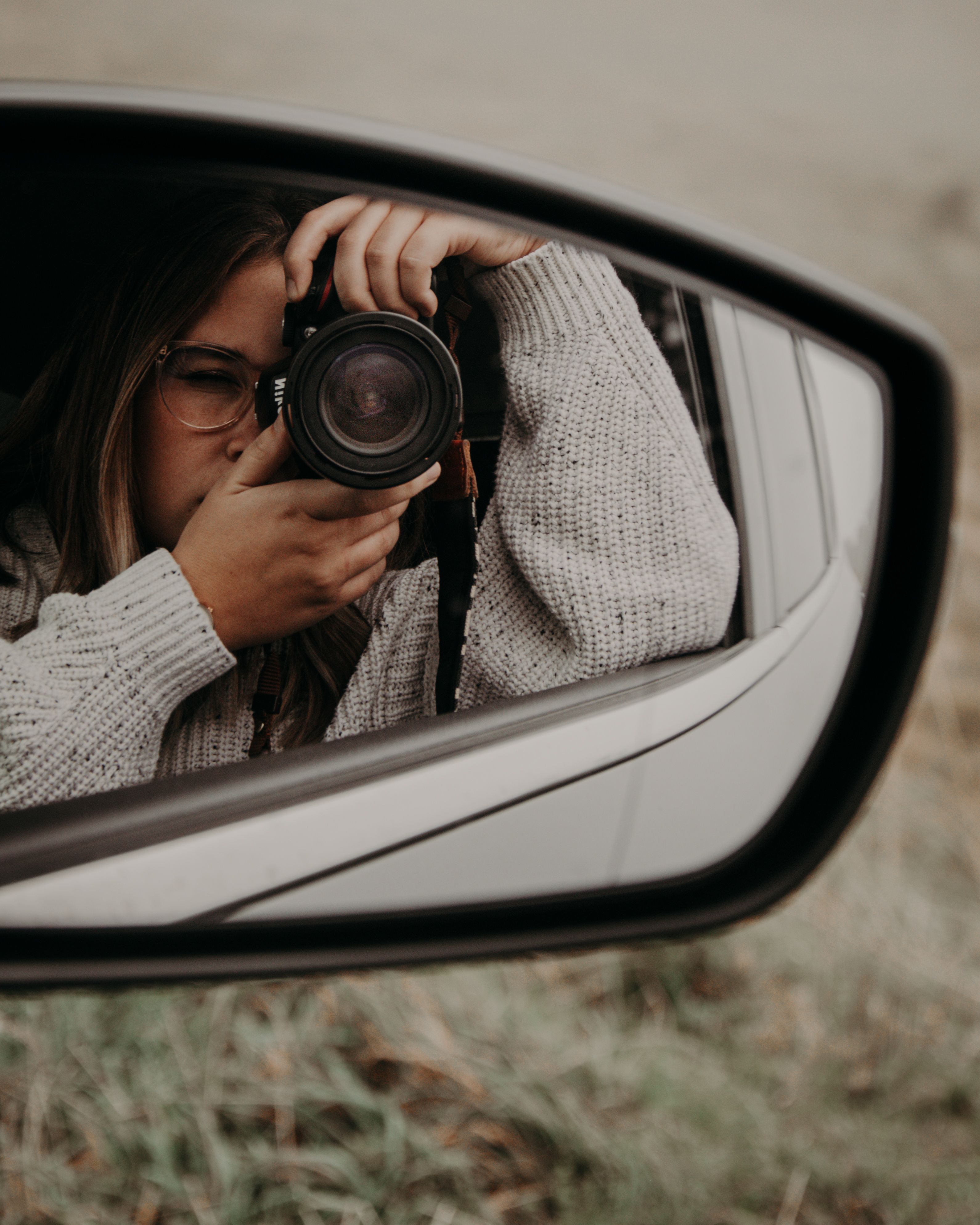 Woman taking photo with camera in mirror · Free Stock Photo