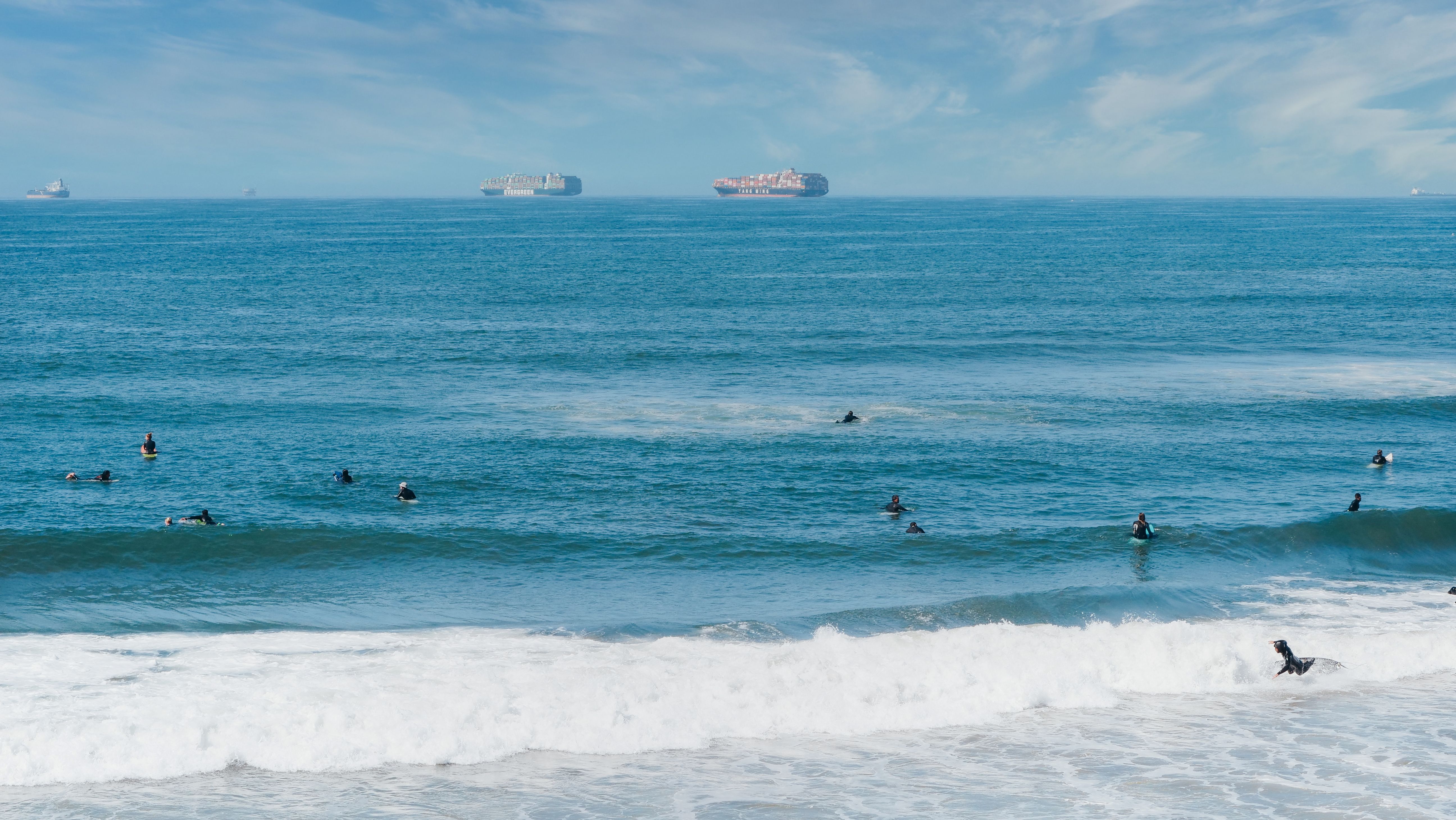 Photo of People Surfing on the Sea · Free Stock Photo