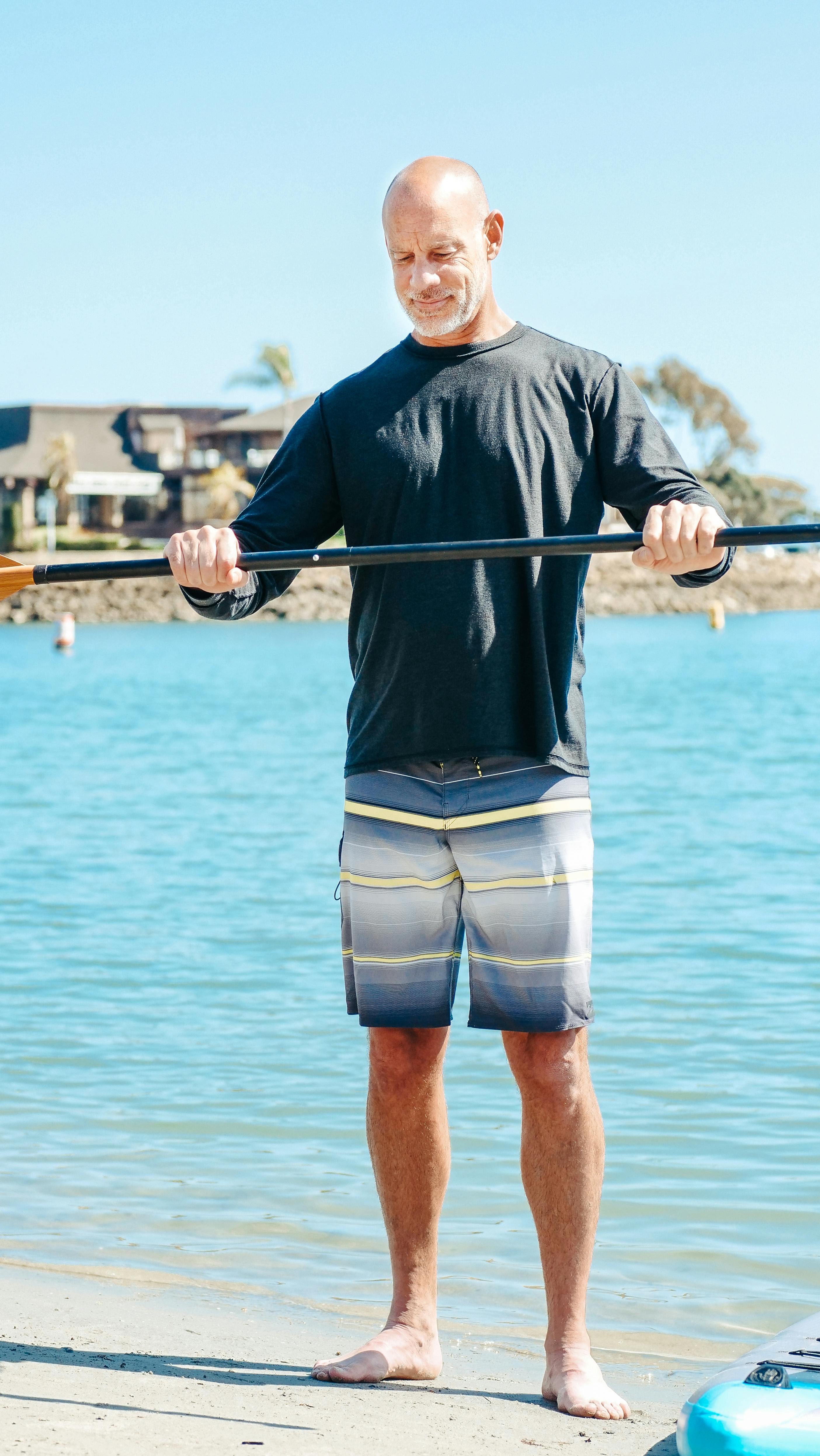 A Man Holding a Rod · Free Stock Photo