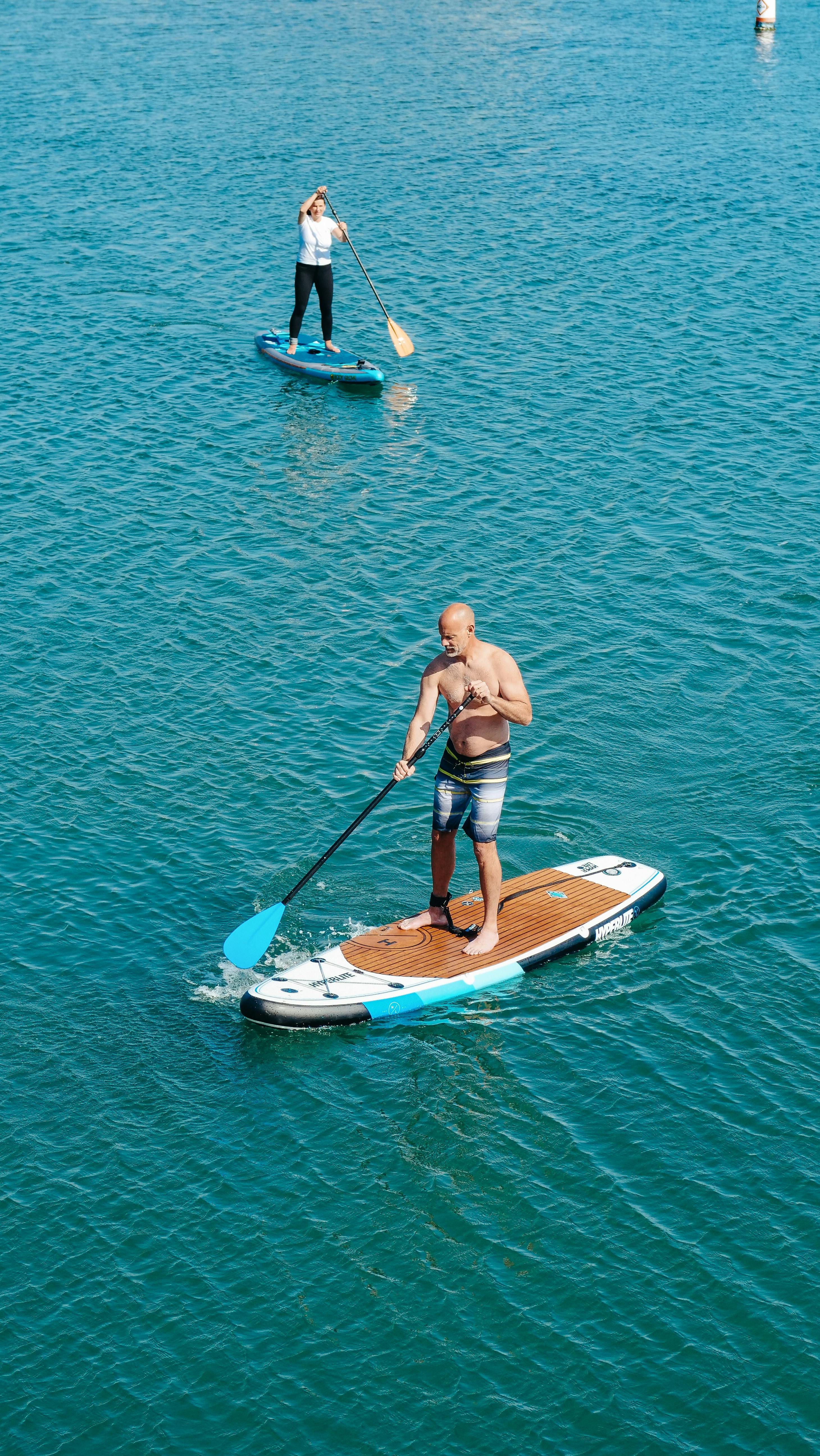 People Paddleboarding on Sea · Free Stock Photo