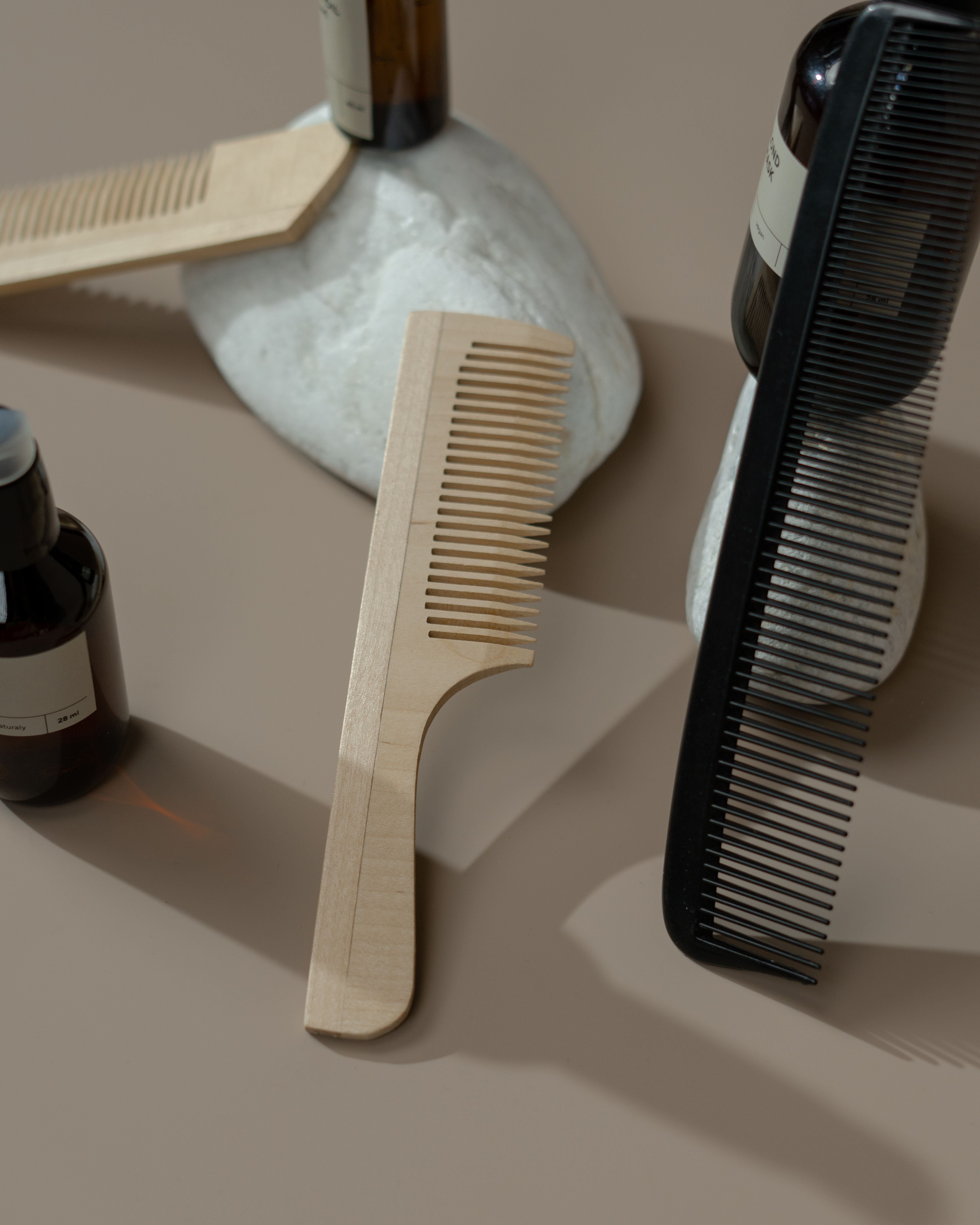 Brown Wooden Hair Comb on White Textile · Free Stock Photo