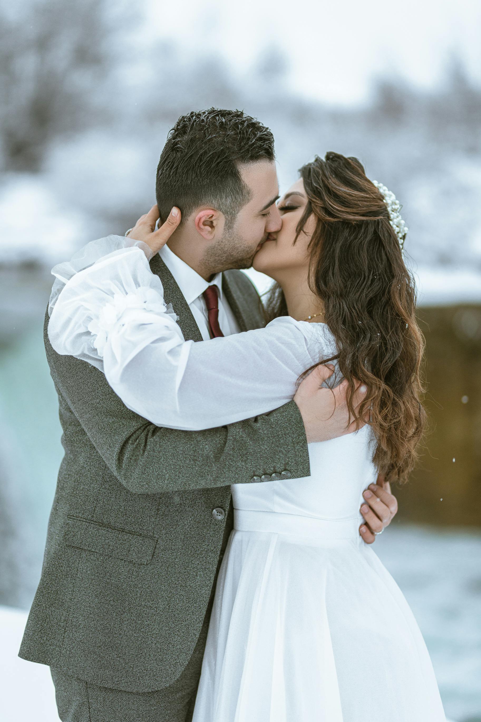A Groom Kissing the Bride on the Head · Free Stock Photo