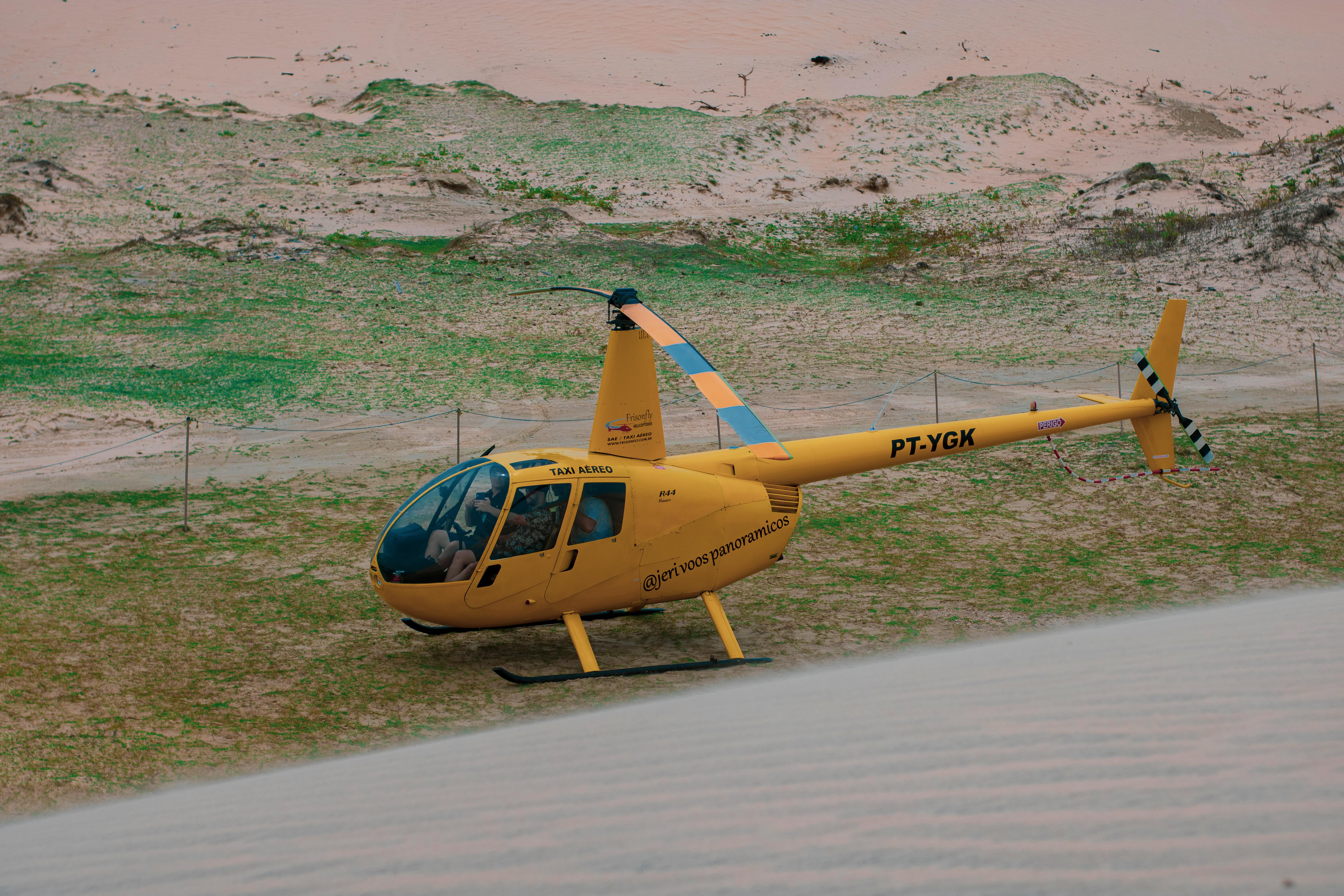 A Yellow Helicopter on the Field · Free Stock Photo