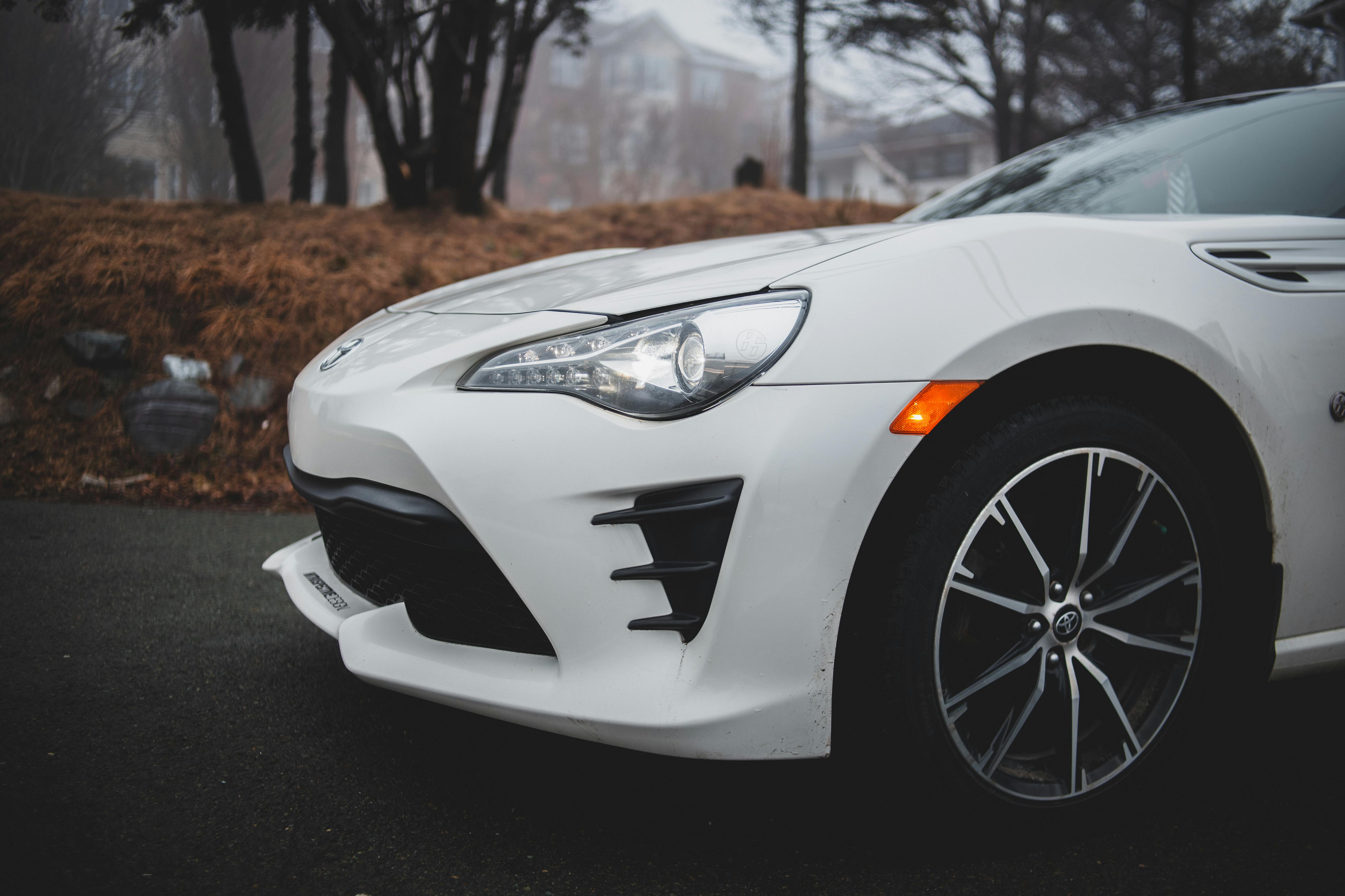 Contemporary white car parked on street · Free Stock Photo