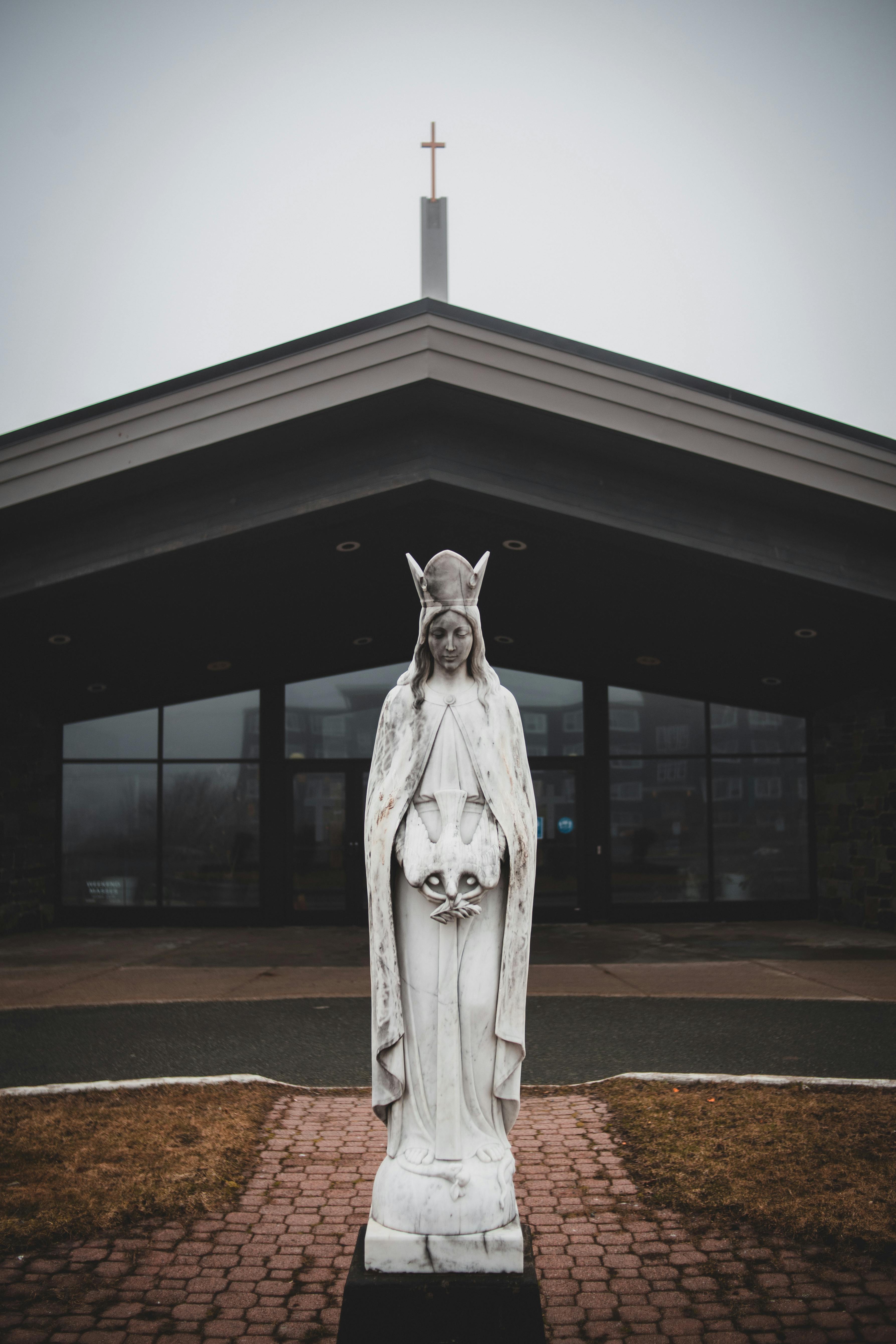 Facade of ancient Roman Catholic church on sunny day · Free Stock Photo