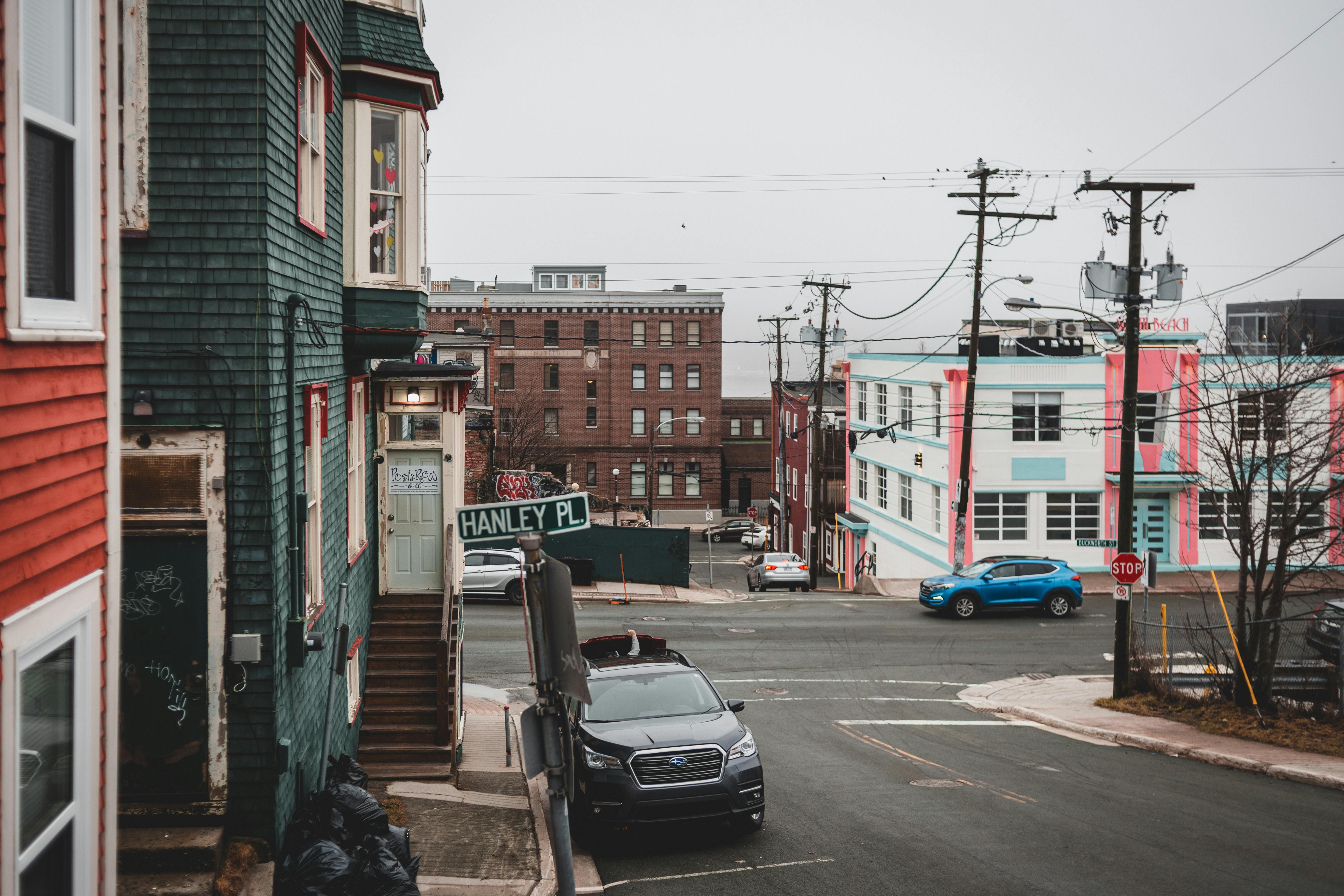 Typical buildings with cars on street · Free Stock Photo