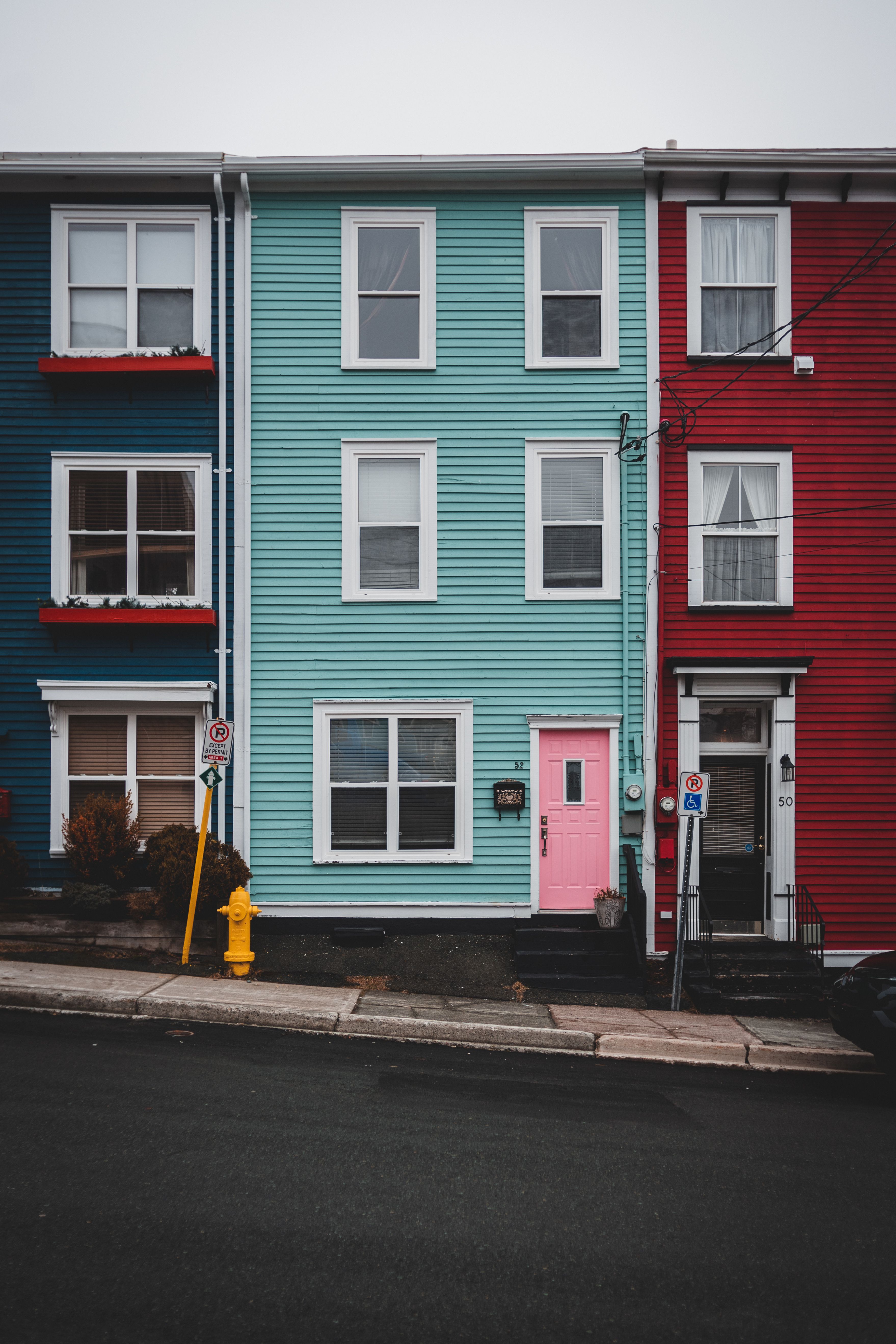 Architectural Photography of Three Pink, Blue, and Yellow Buildings ...