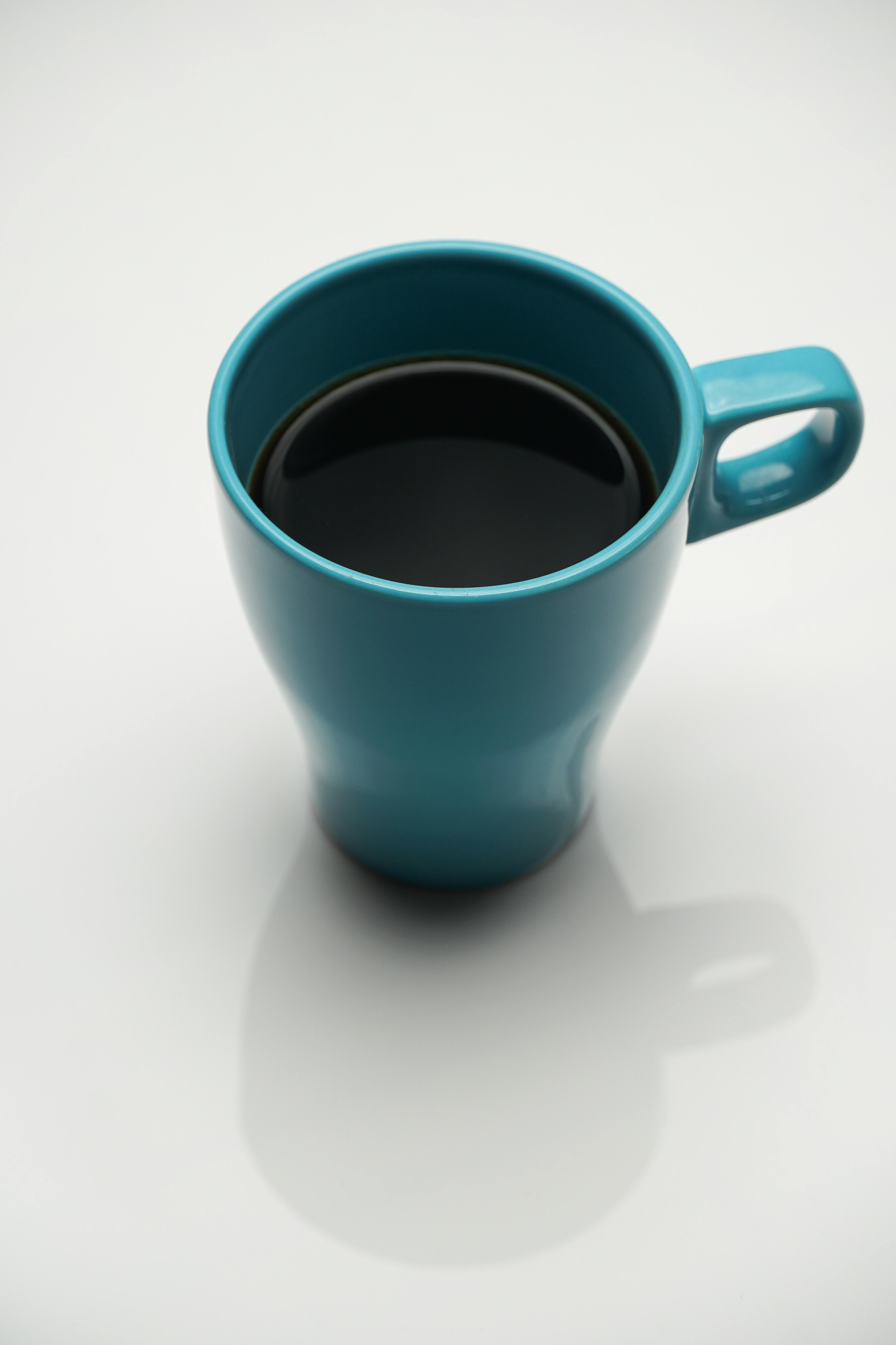 Close-Up Photo of a Blue Mug with Black Coffee · Free Stock Photo