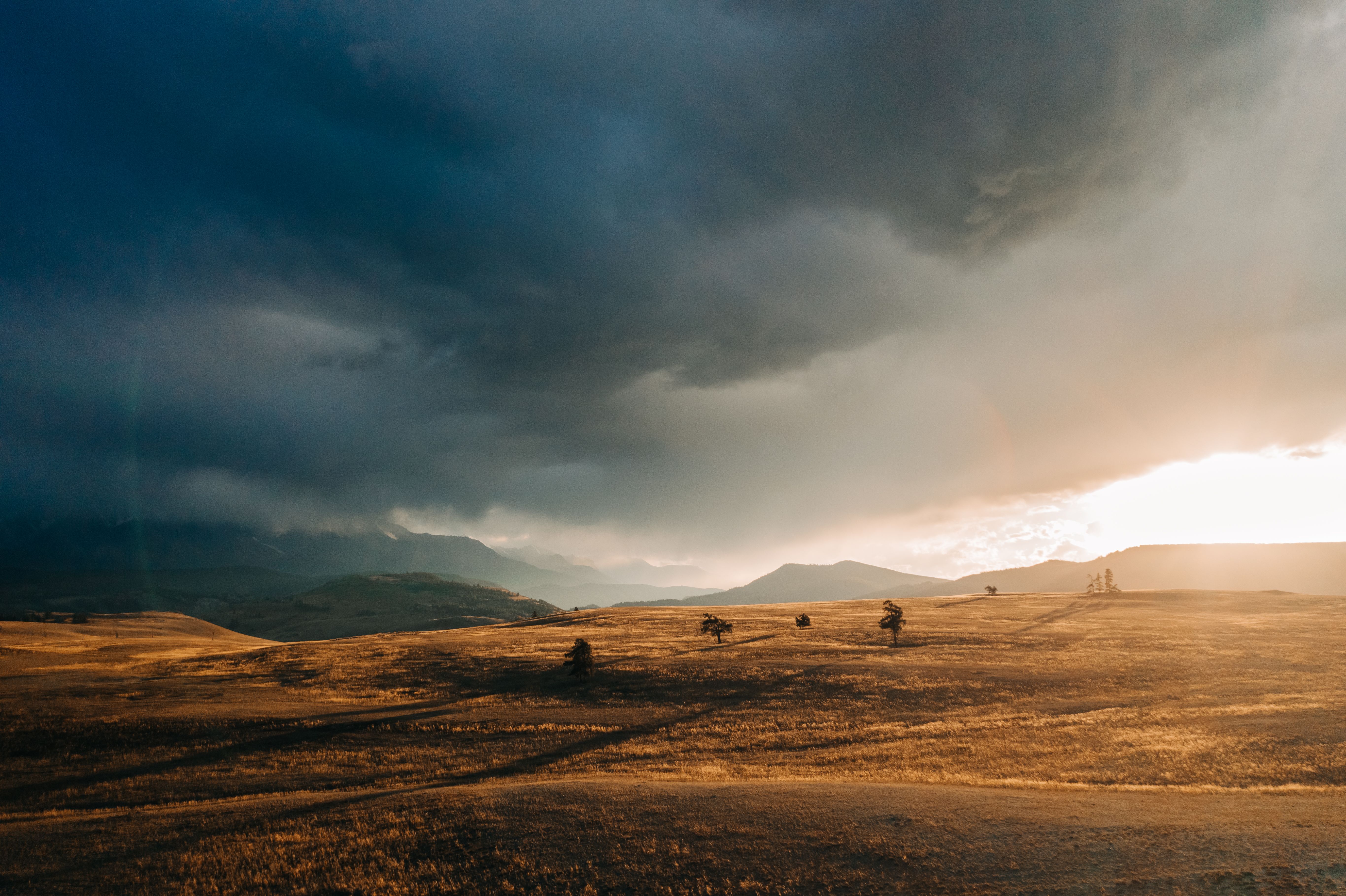 Mountains and Grass Field during Sunset · Free Stock Photo