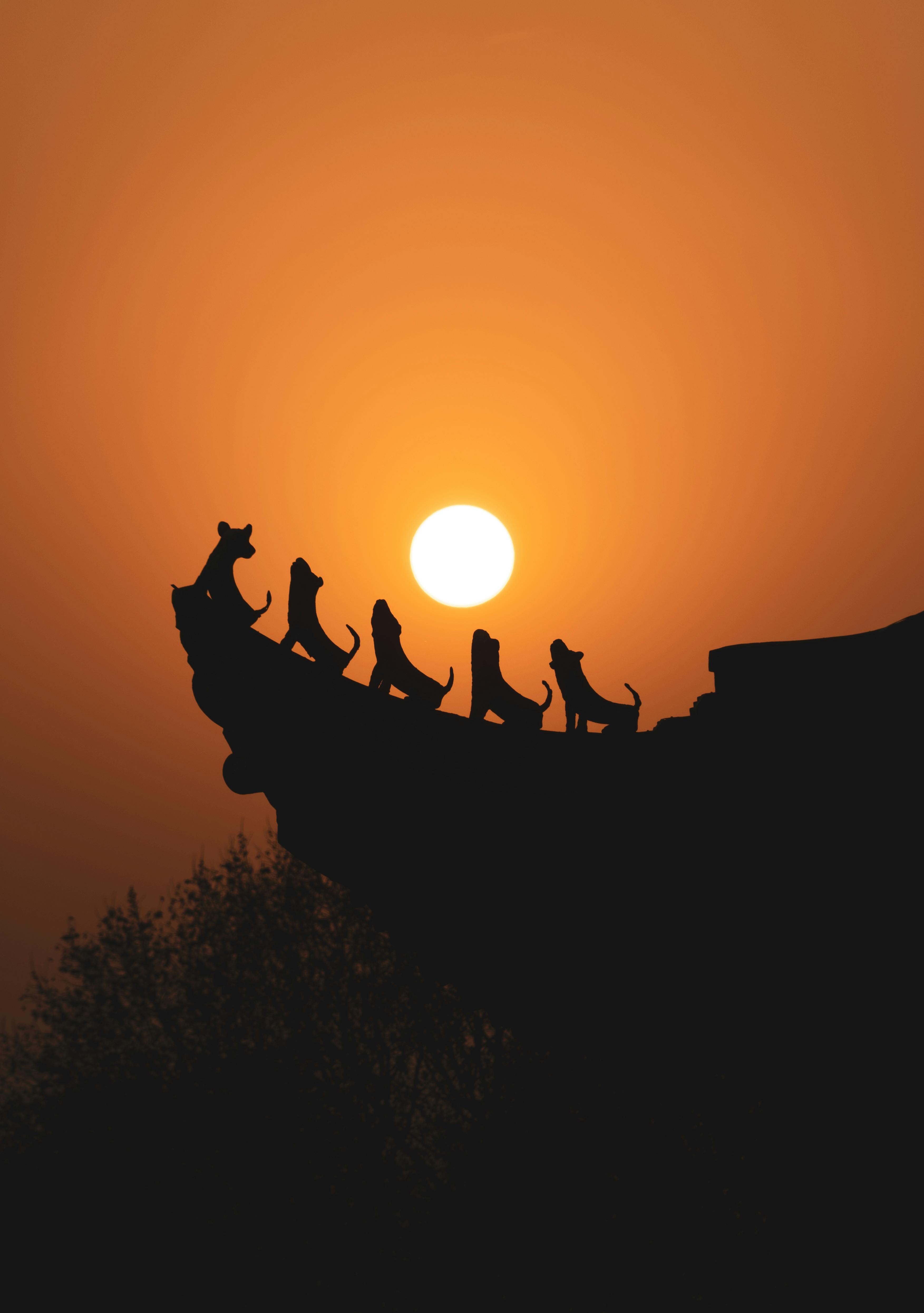 Woman Statuette during Golden Hour · Free Stock Photo