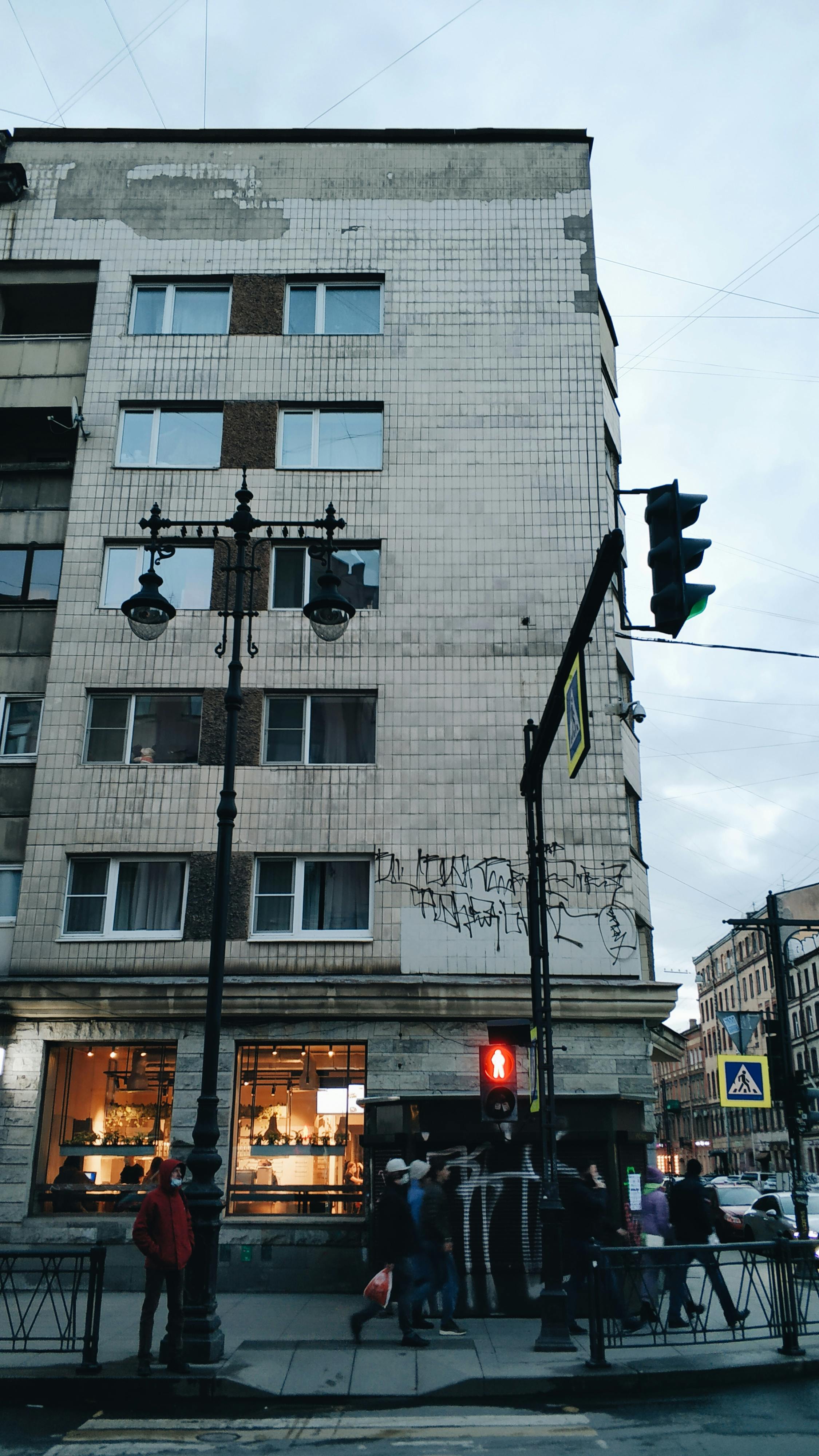 Faceless people on sidewalk near building facade in town street · Free ...