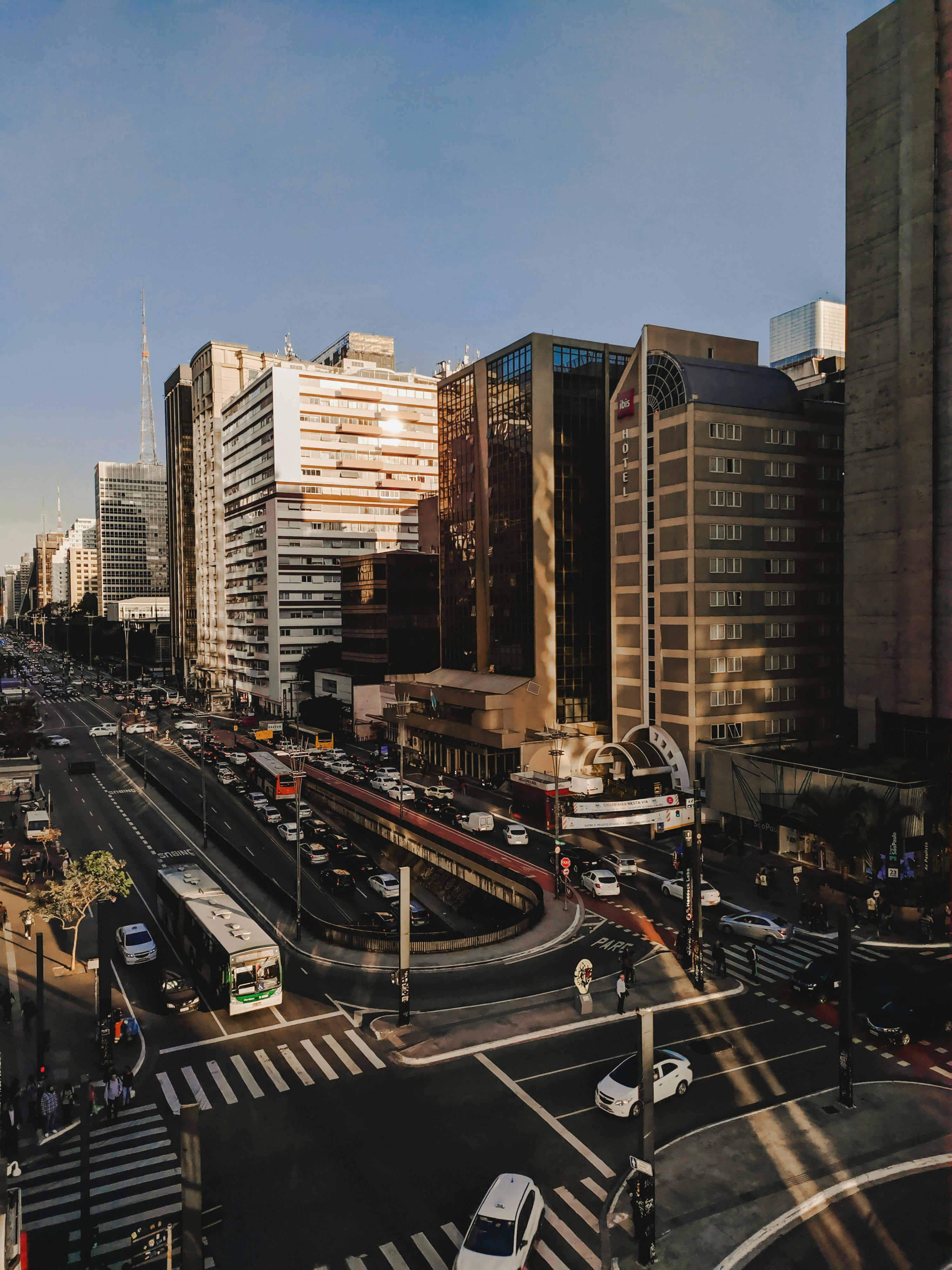 Road with red traffic light under bridge · Free Stock Photo