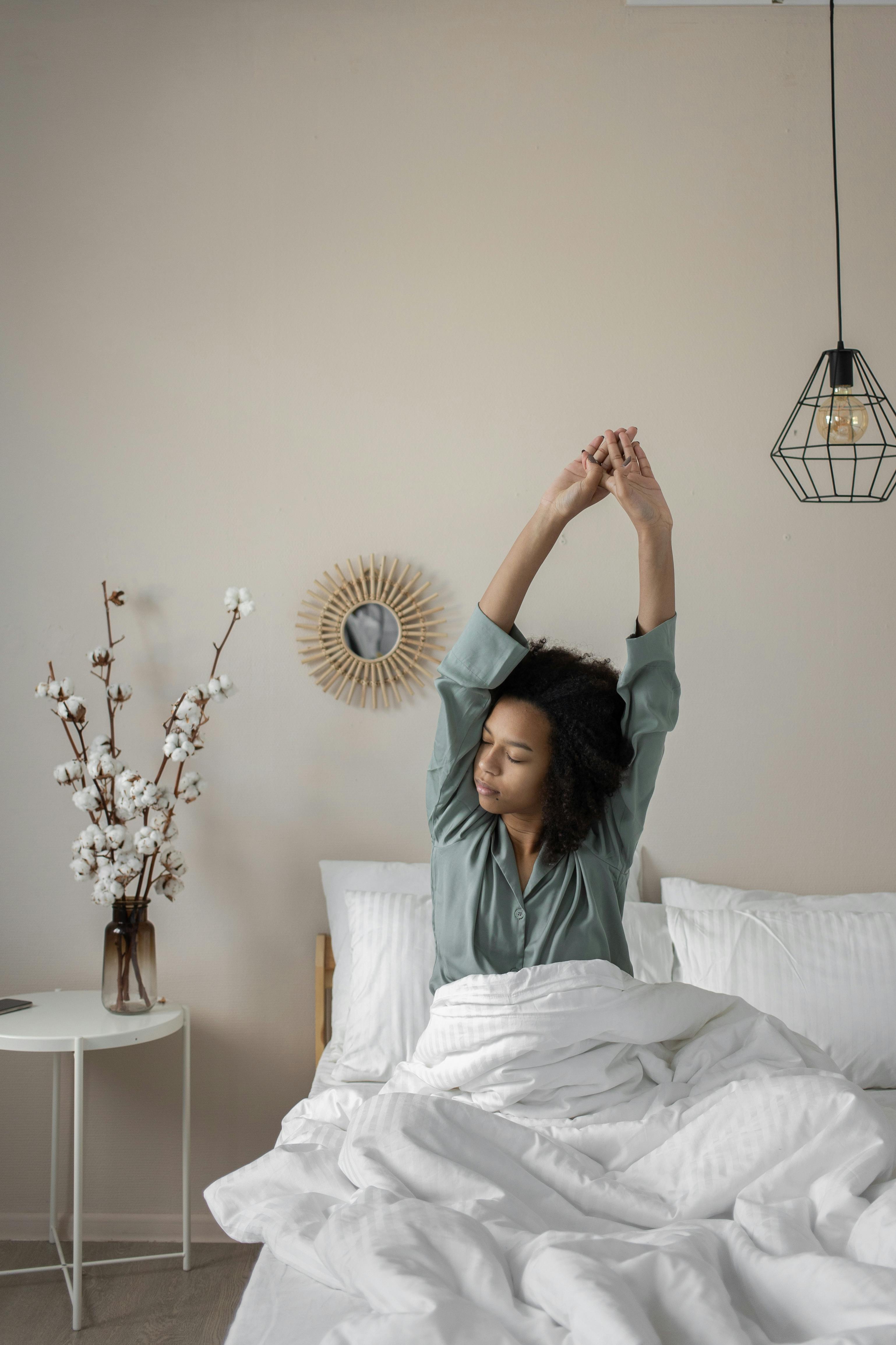 A Woman Sitting on the Bed · Free Stock Photo