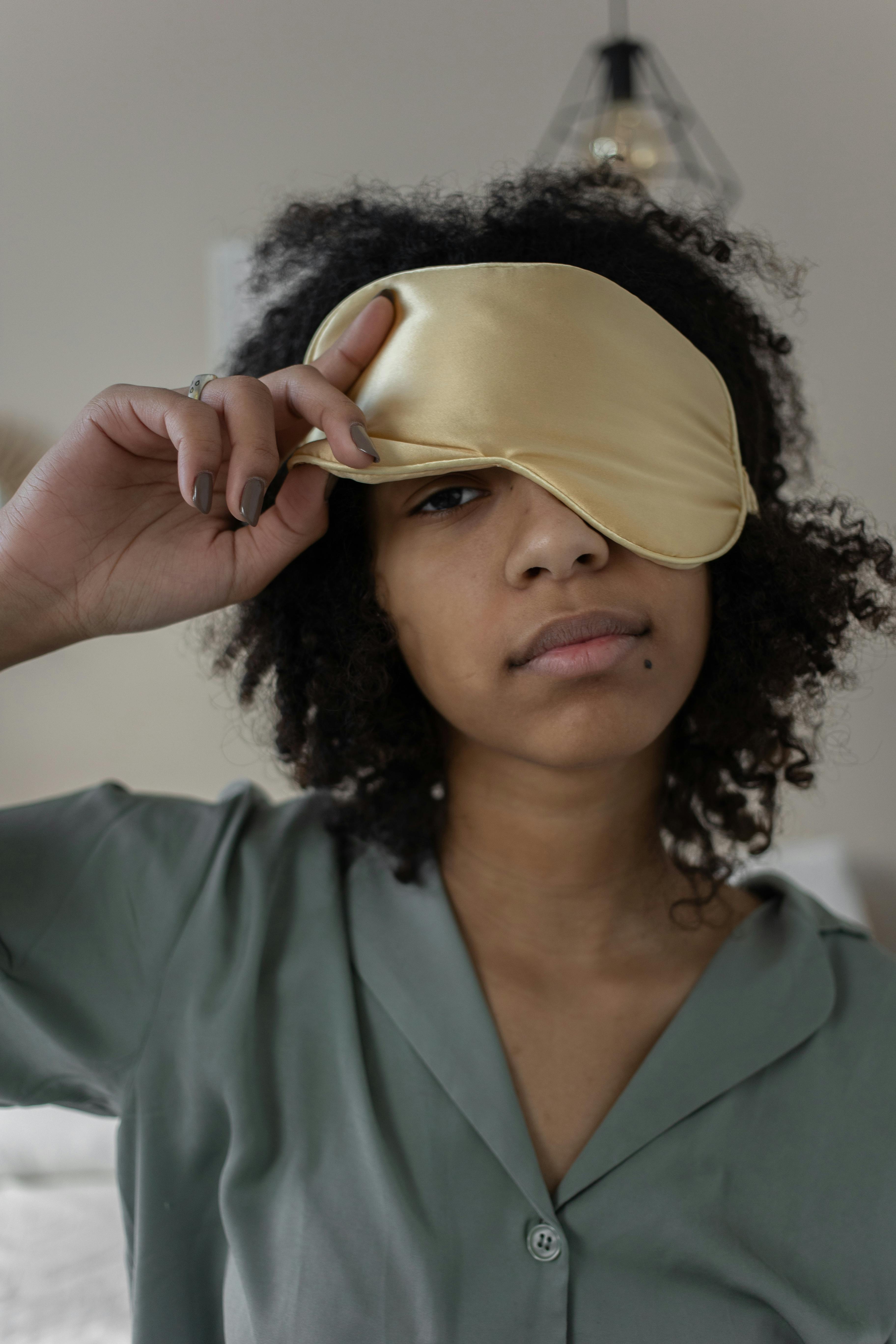 A Woman Wearing Gold Sleep Mask · Free Stock Photo