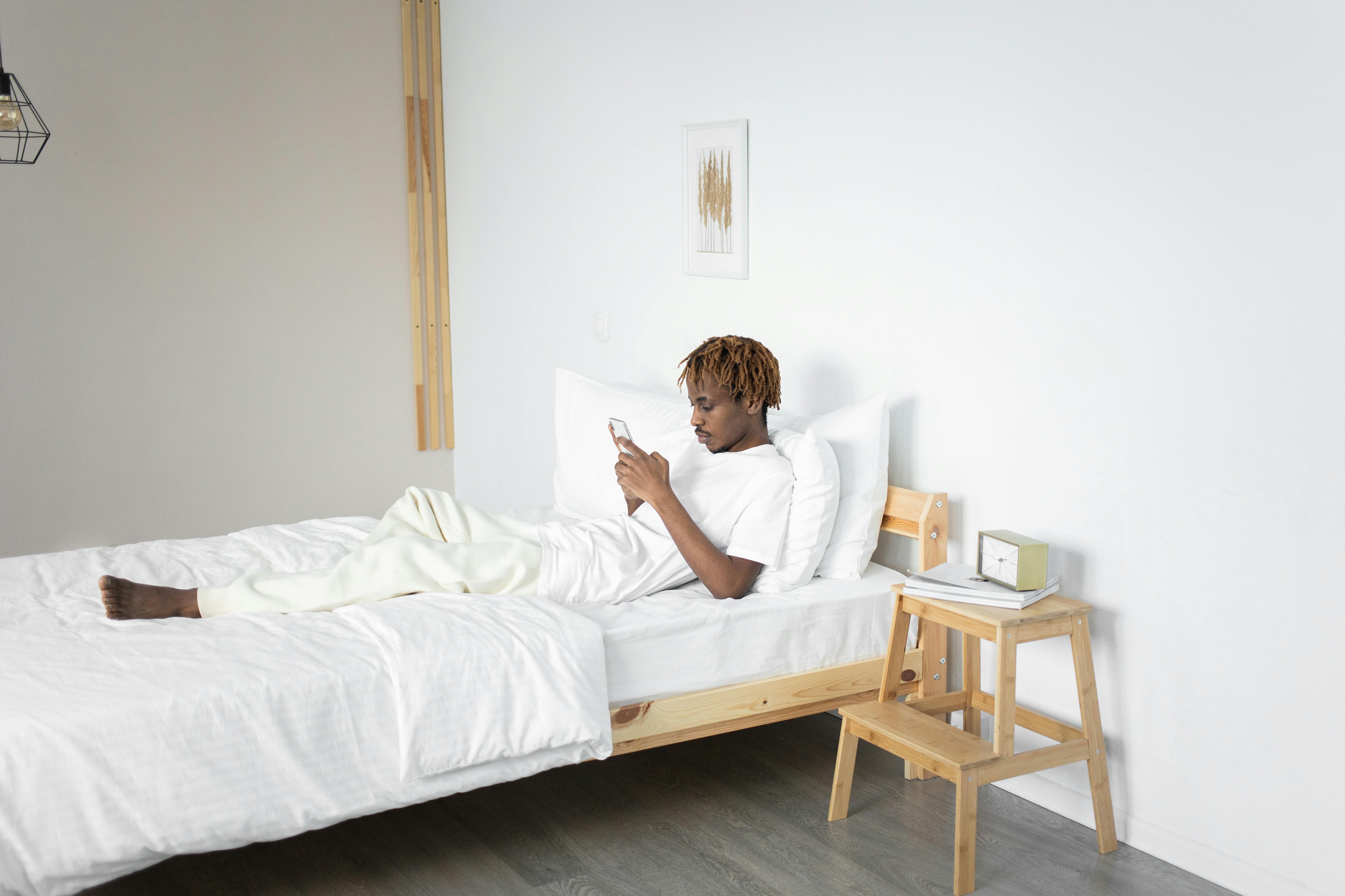 A Man Lying Down on a Bench · Free Stock Photo