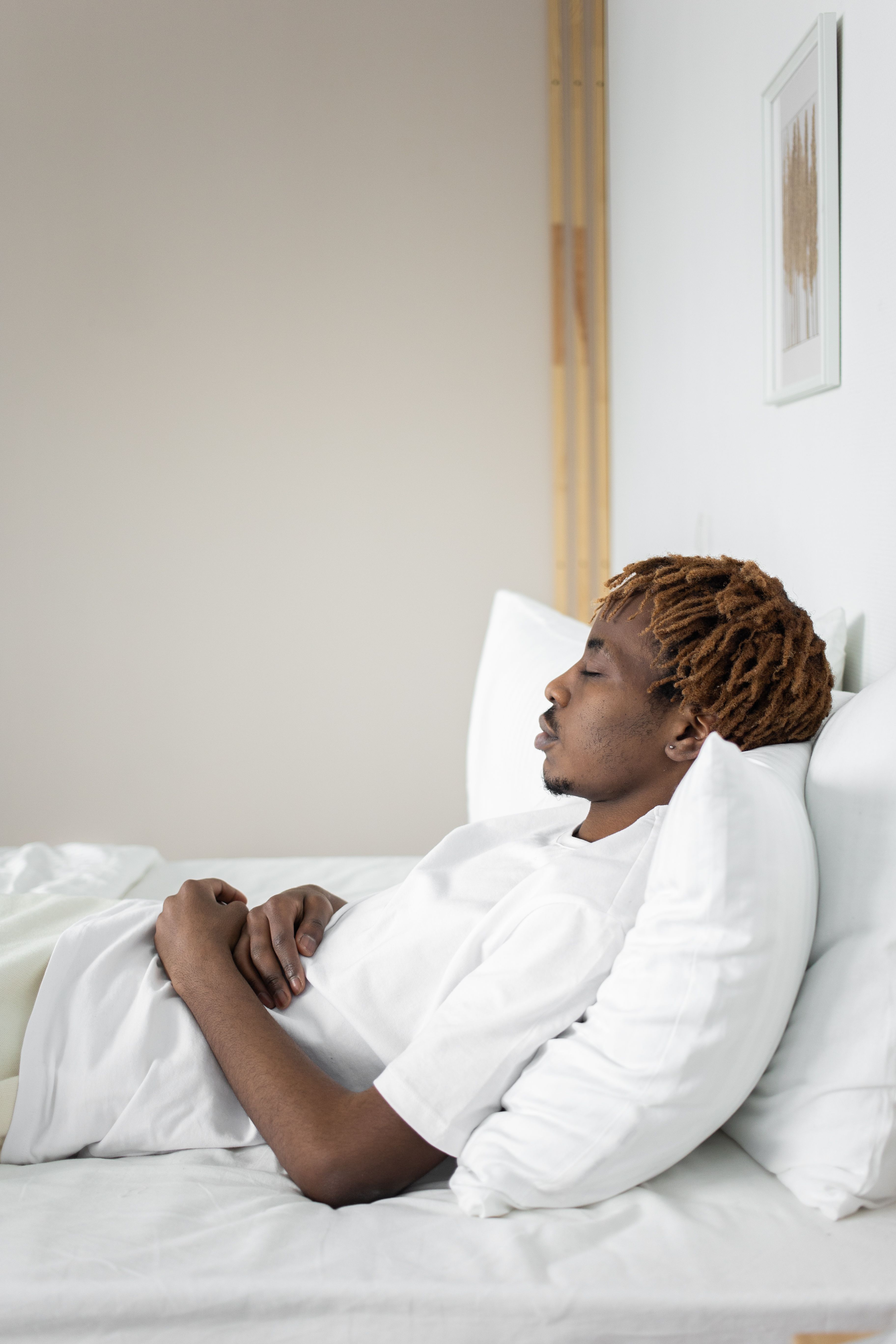 Person Lying in Bed Beside Window · Free Stock Photo