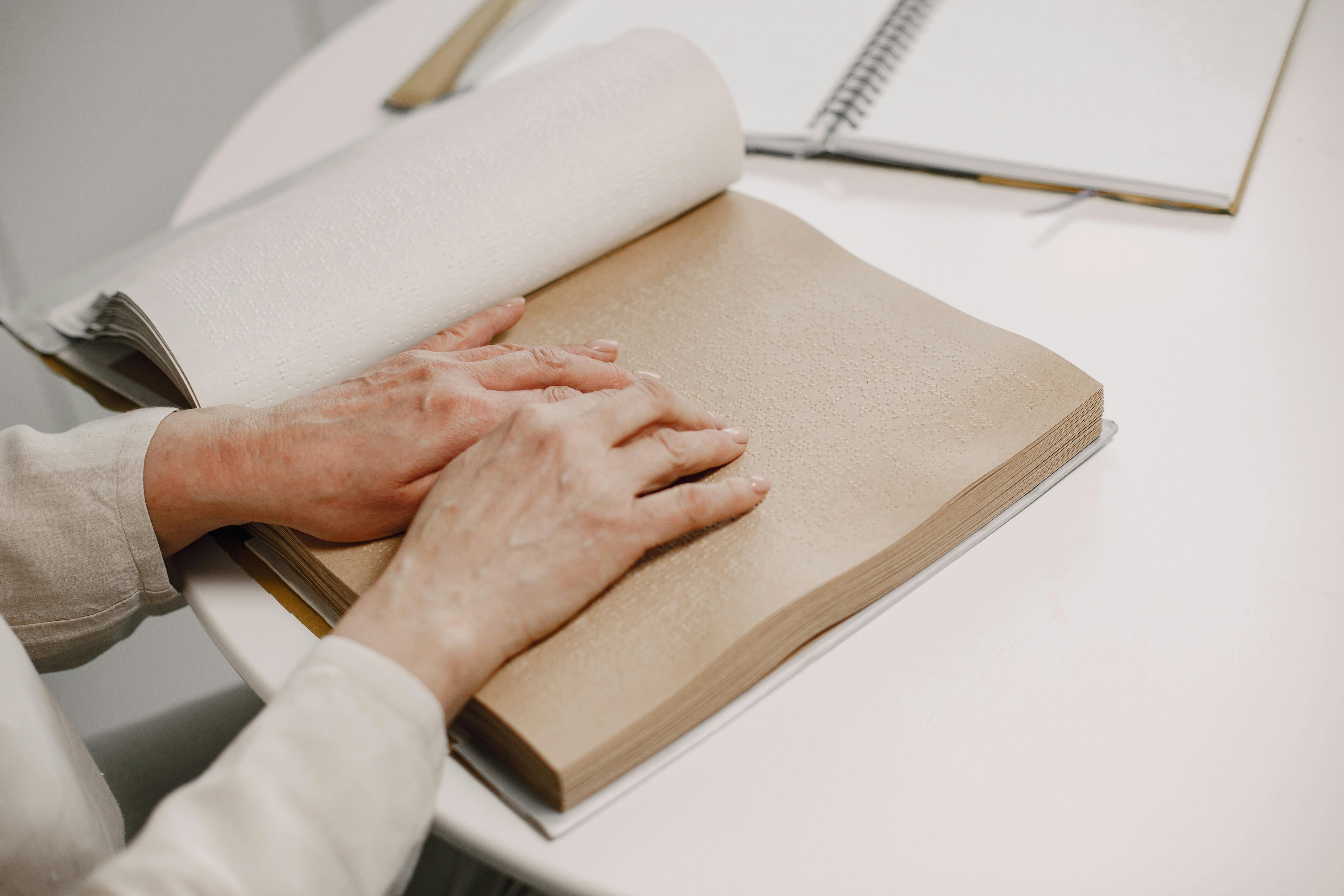 Person Reading Braille Book · Free Stock Photo