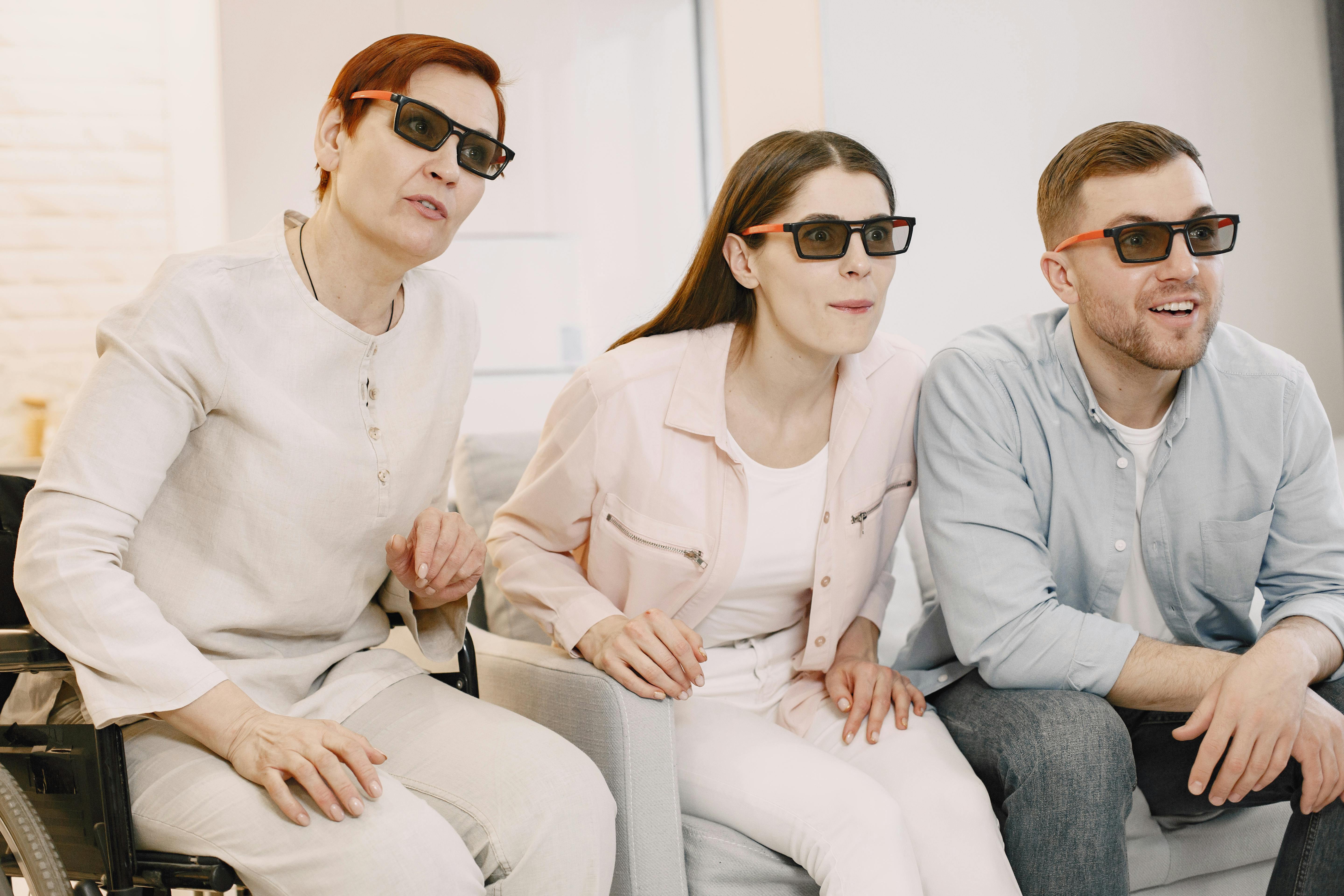 Three people watching something in Eyeglasses · Free Stock Photo
