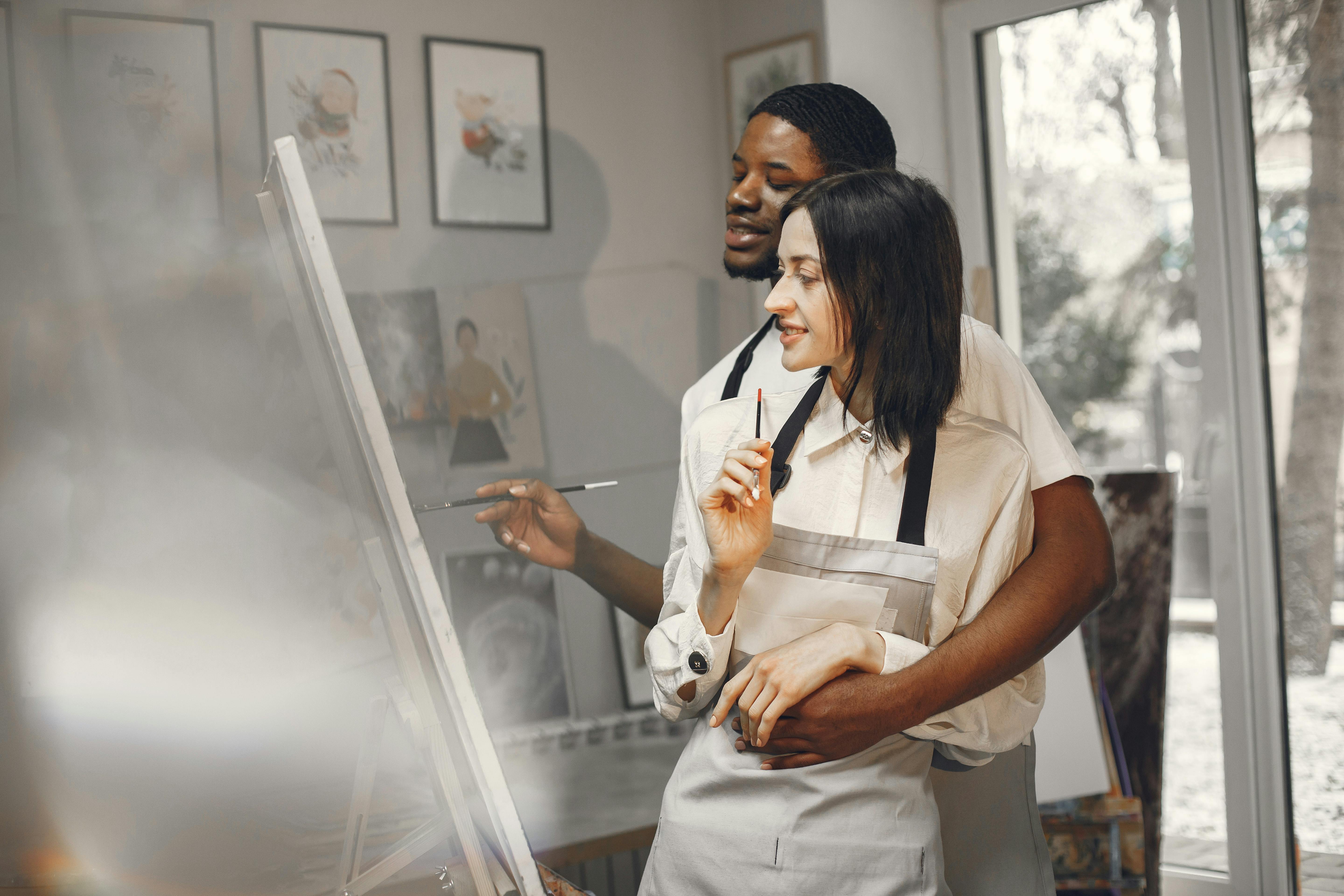 Couple Painting Together · Free Stock Photo