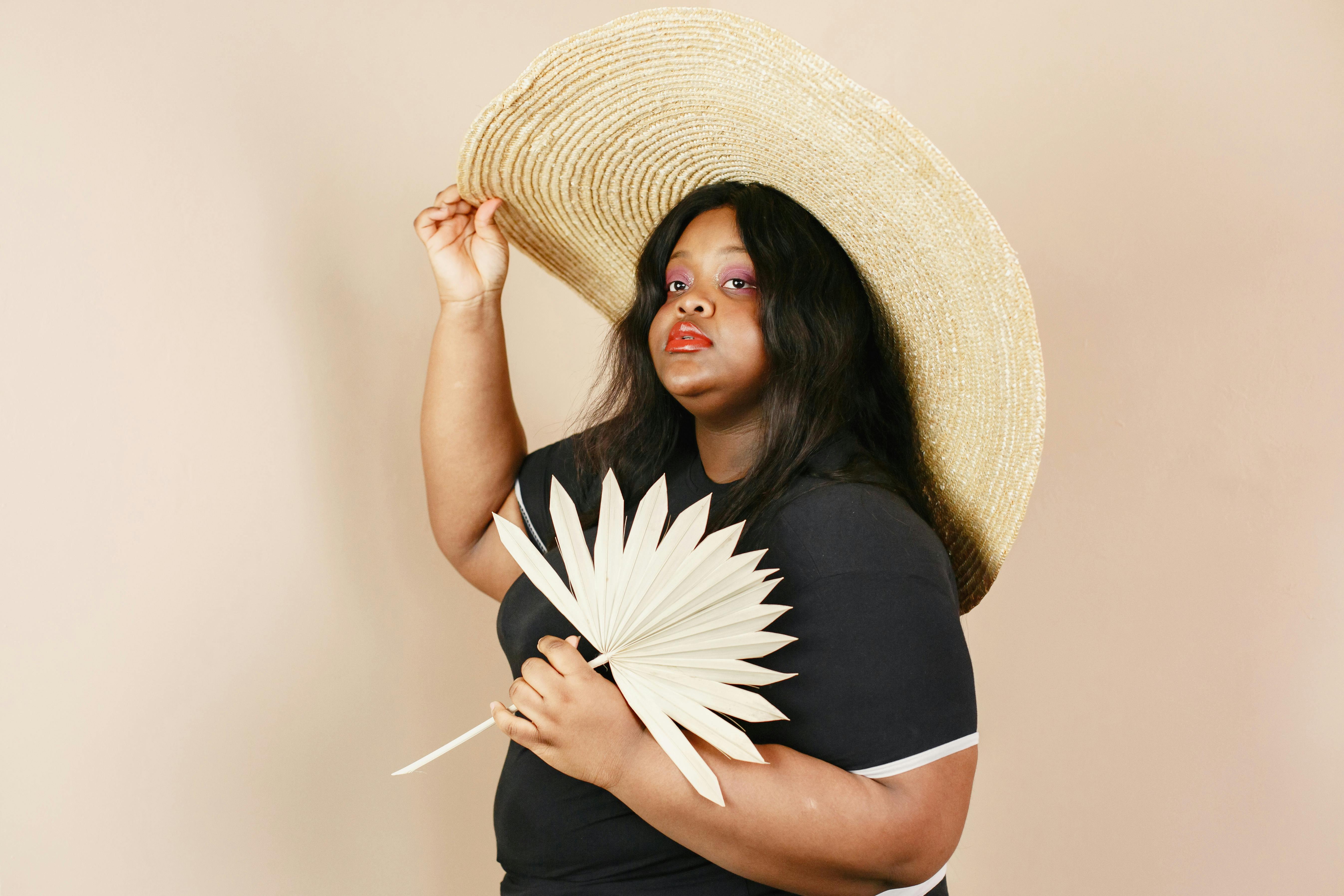 Woman Wearing a Big Round Straw Hat · Free Stock Photo