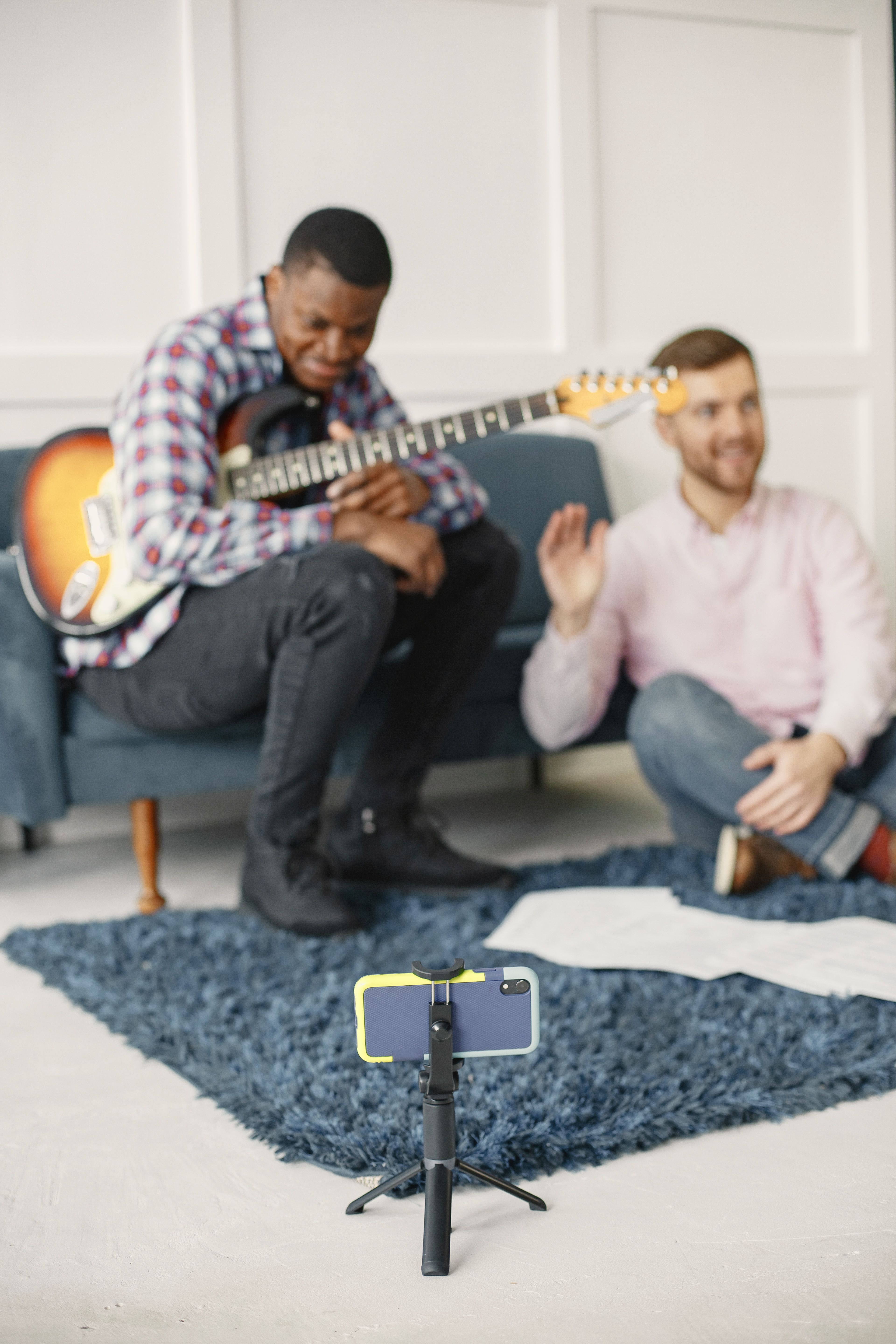 Men Recording Themselves Playing the Guitar and Singing · Free Stock Photo