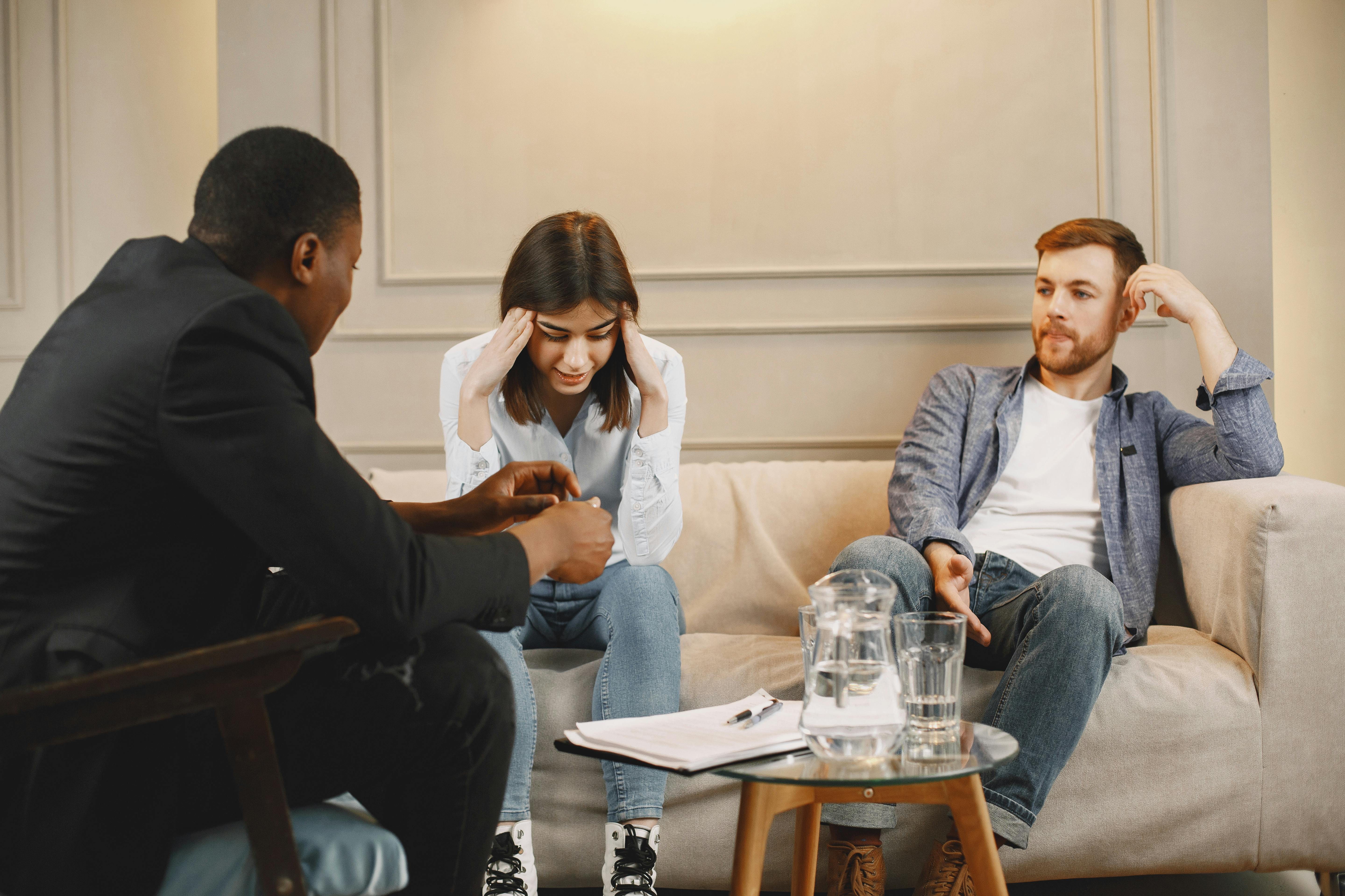Couple Sitting on Couch in Therapist Office · Free Stock Photo