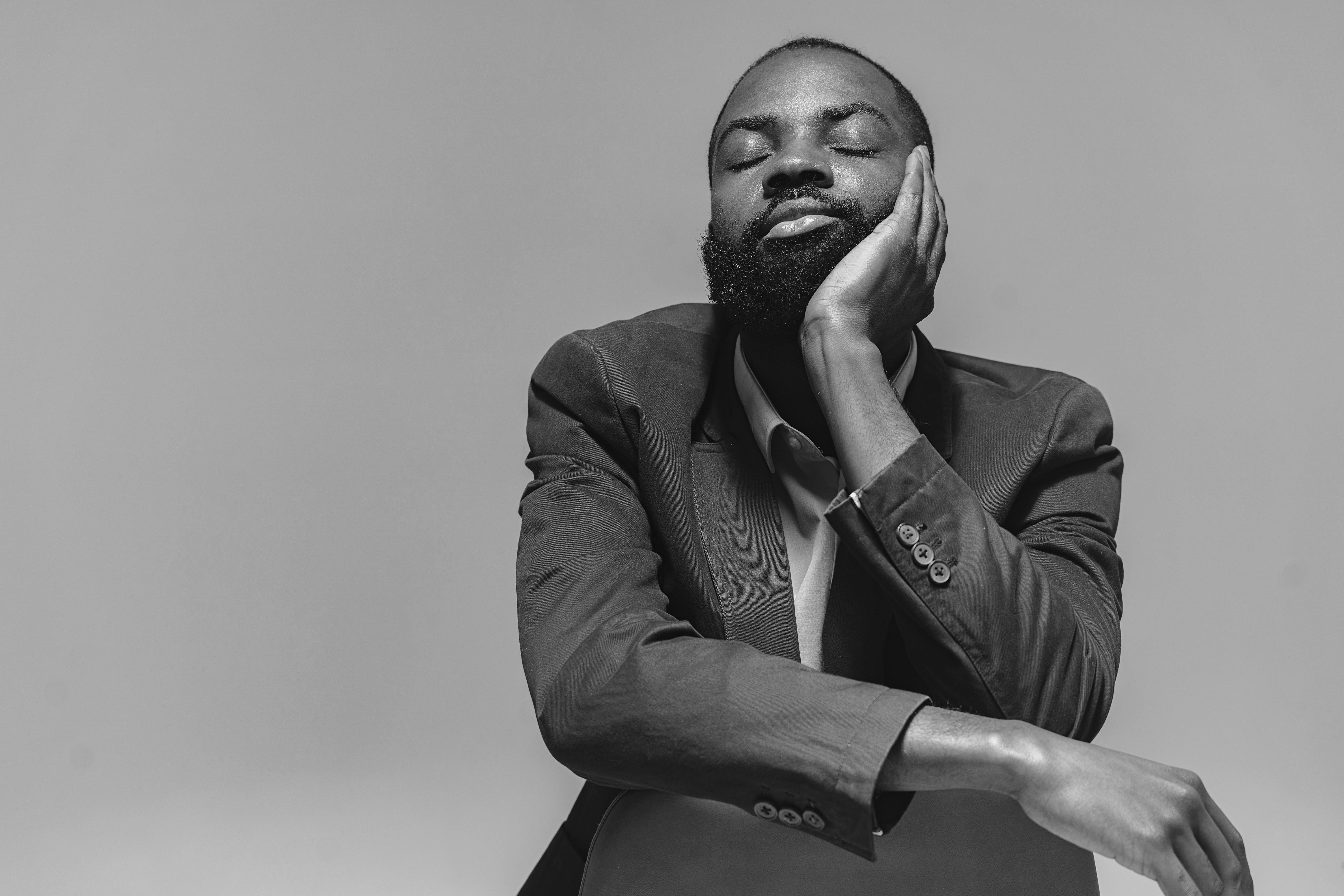 Grayscale Photo of a Man with his Hand on Face and Eyes Closed · Free ...