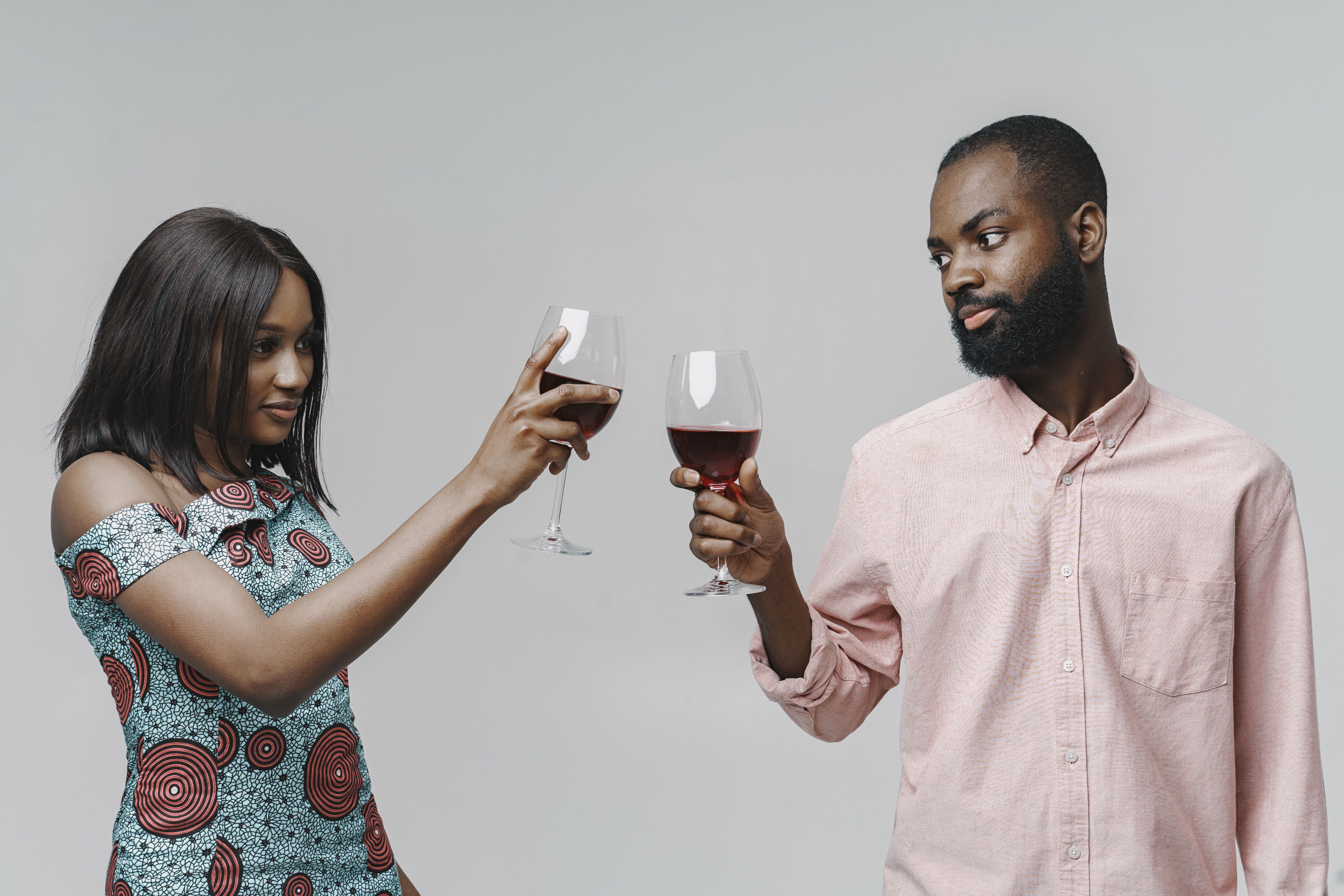 Man and Woman Toast Red Wine Glasses · Free Stock Photo