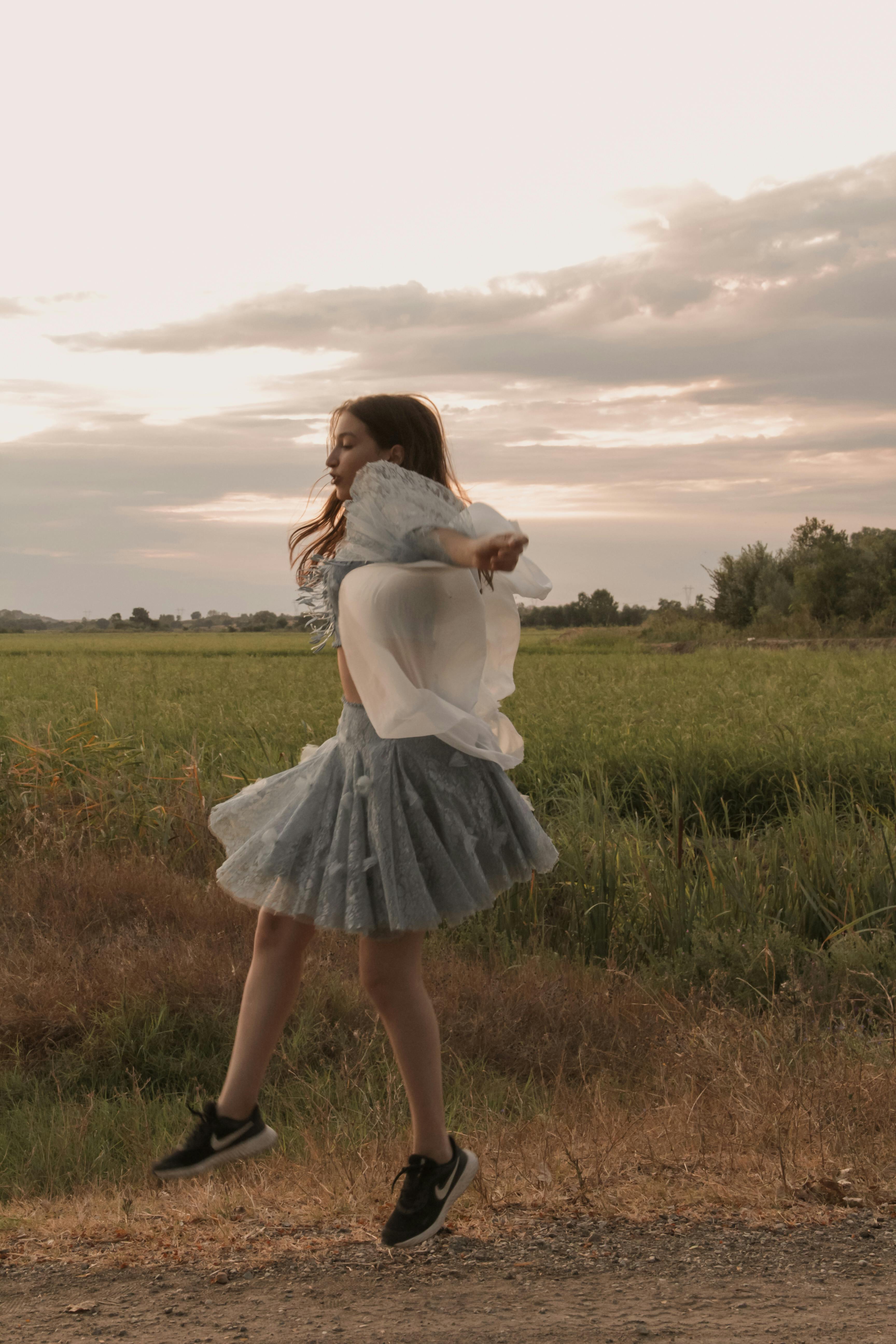 Girl Doing Splits in the Air on a Field · Free Stock Photo