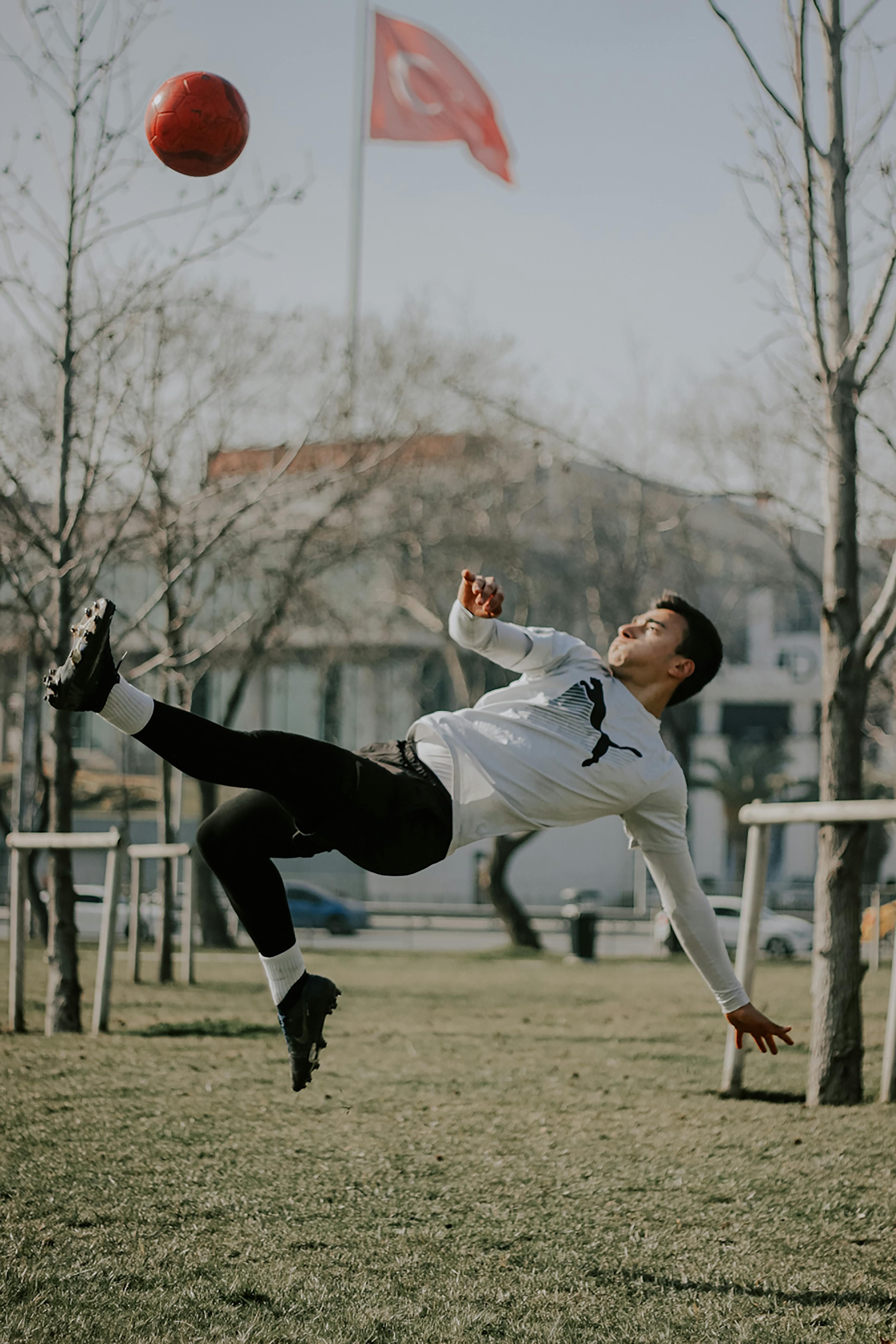 Man Kicking Ball · Free Stock Photo