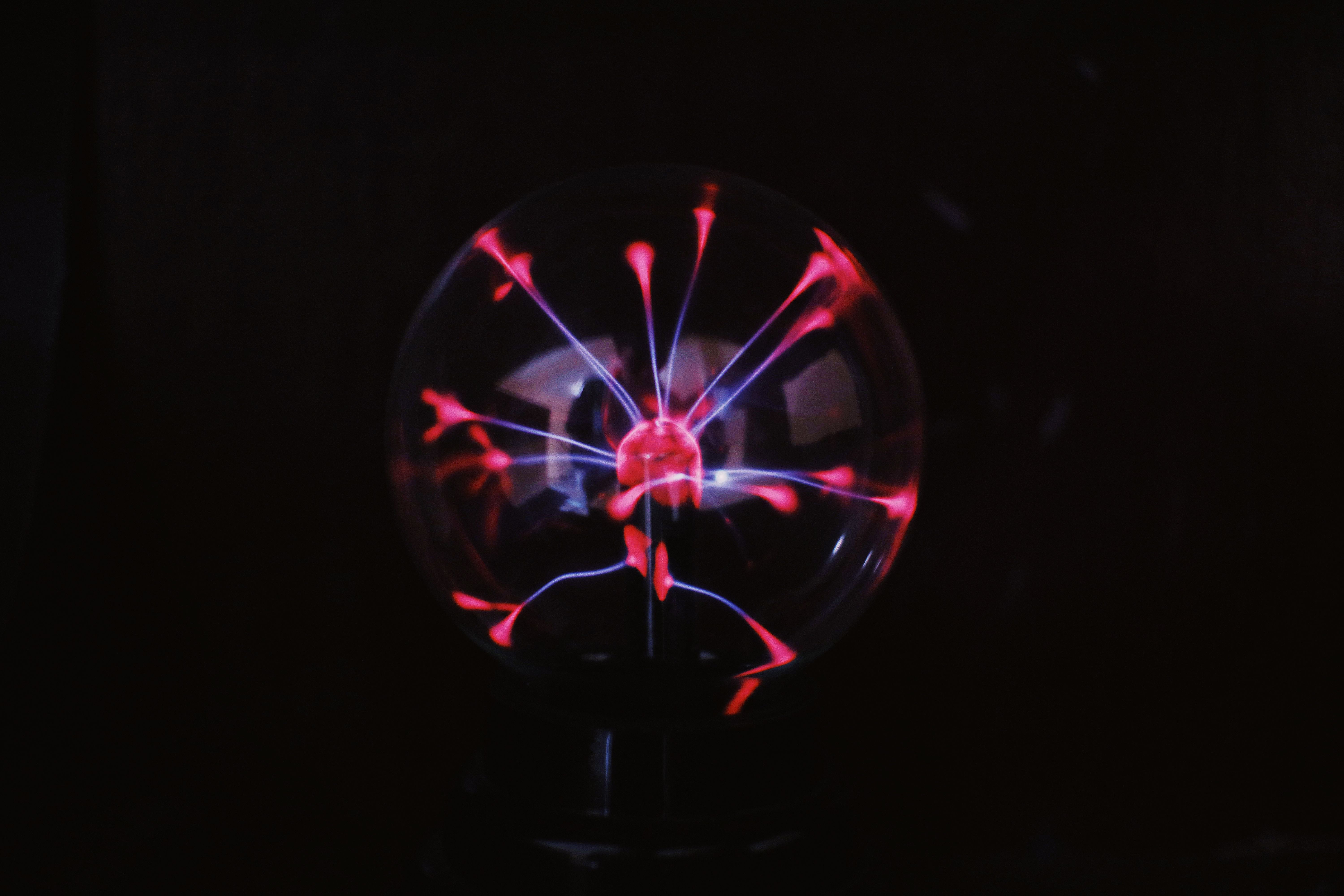 Plasma ball with bright electric light in darkness · Free Stock Photo