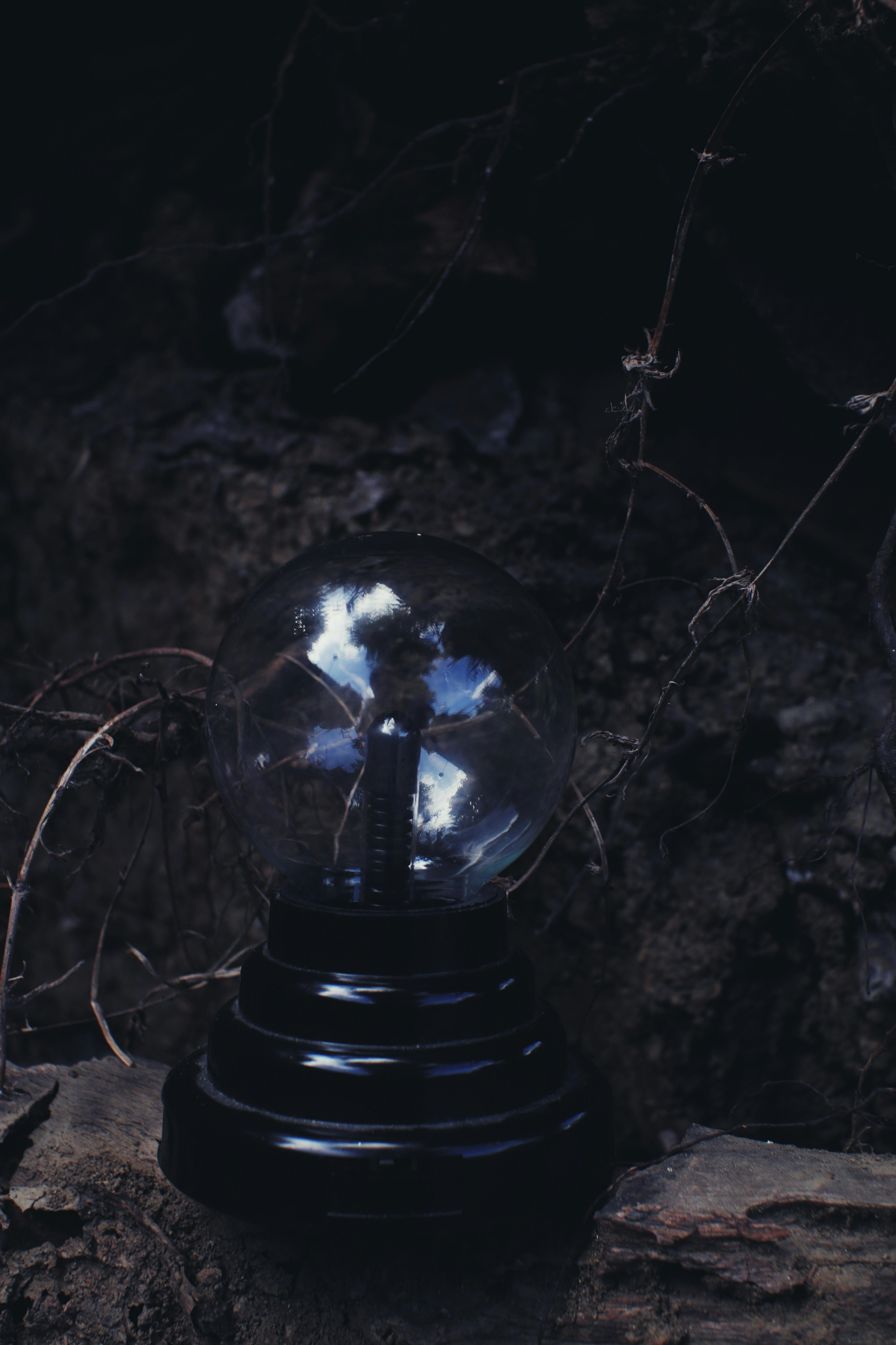 Light Bulb Floating Above Person's Hand · Free Stock Photo