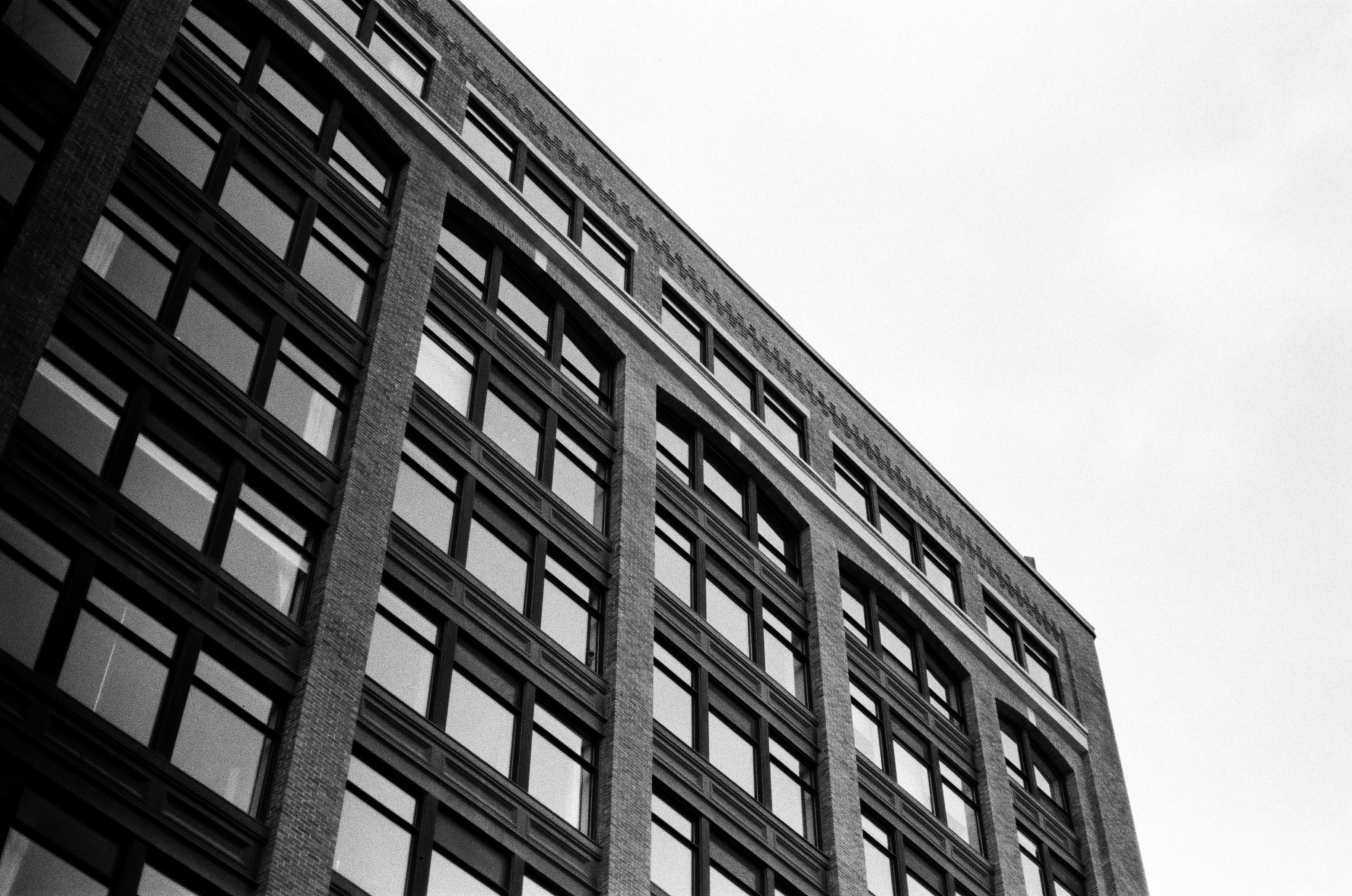 Grayscale Photo of Concrete Building · Free Stock Photo