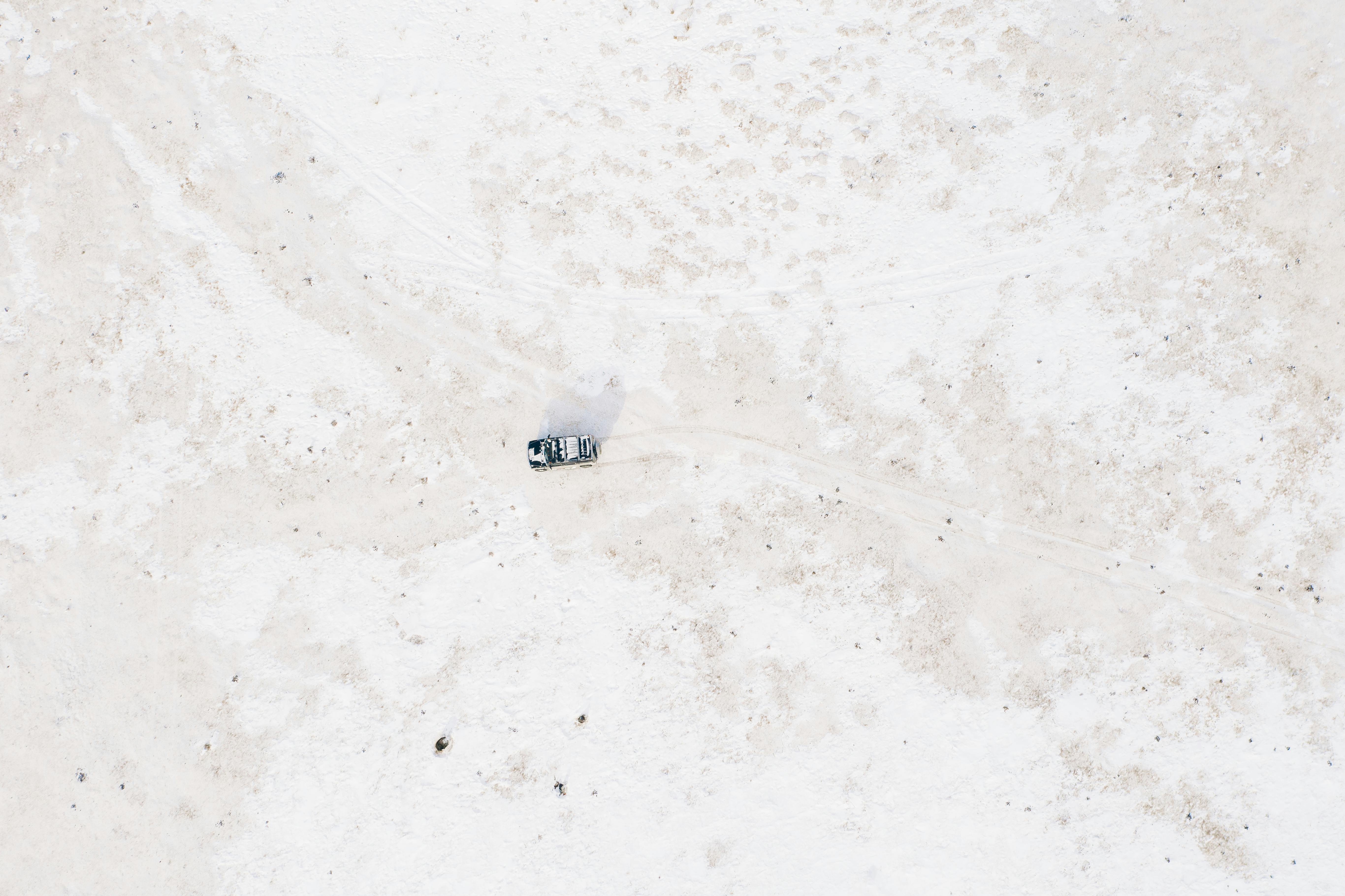 Aerial Shot of SUV on Snow · Free Stock Photo